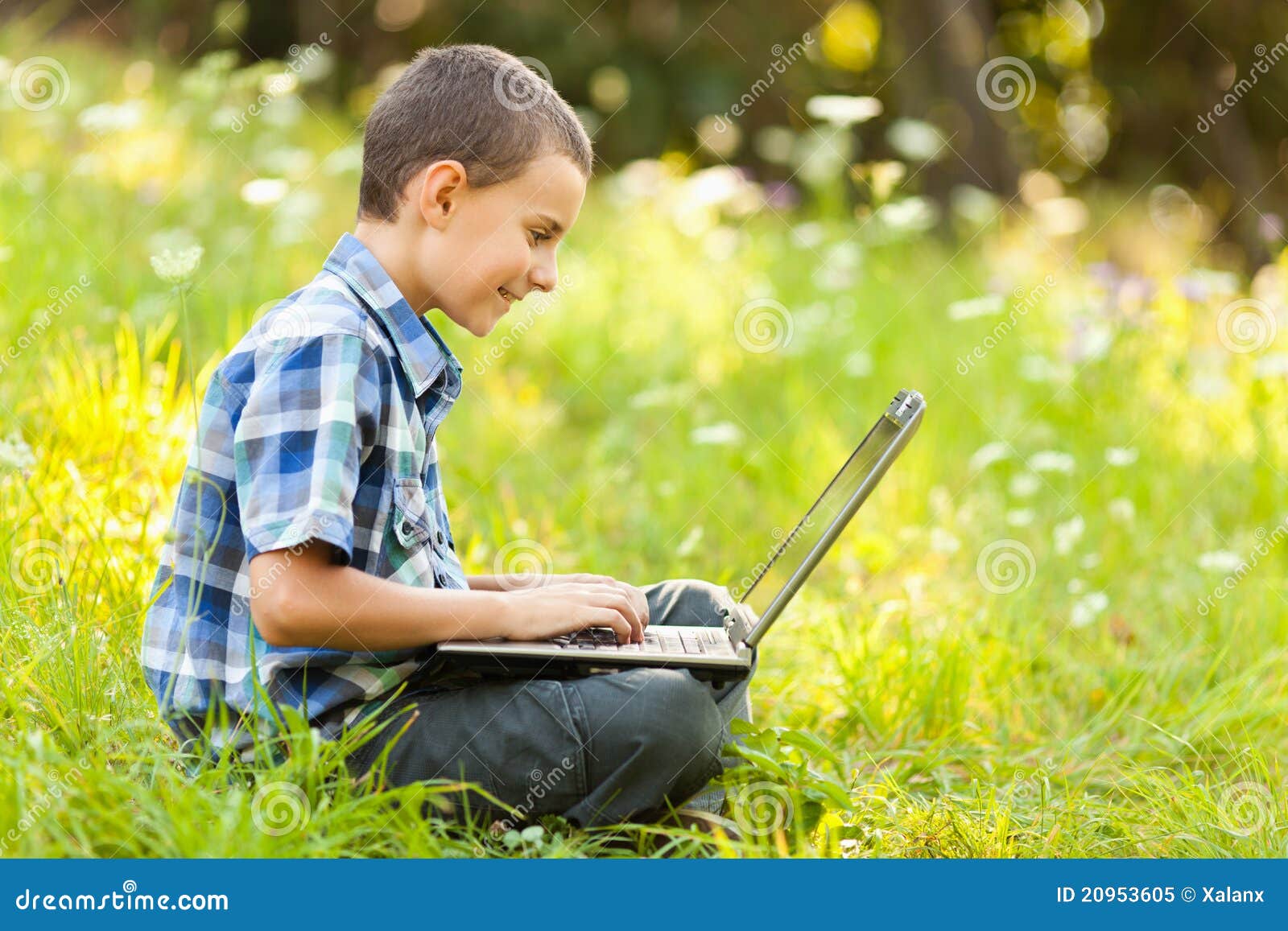 Boy using laptop outdoor stock image. Image of child - 20953605