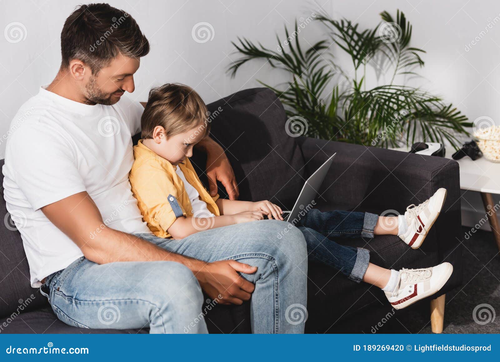 Boy Using Laptop while Sitting on Stock Photo - Image of connection ...
