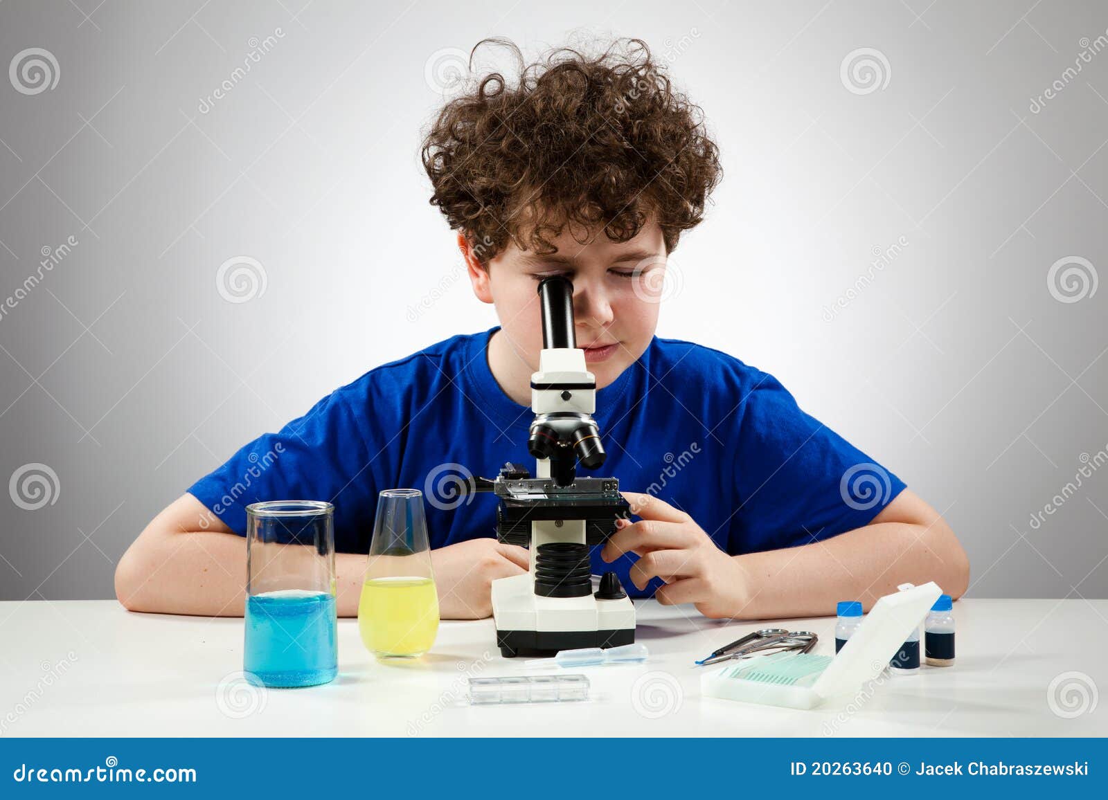Boy using microscope stock photo. Image of examine, front - 20263640