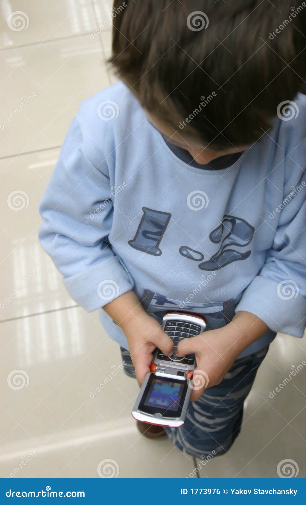 BOY USING a MOBILE PHONE stock photo. Image of babies - 1773976