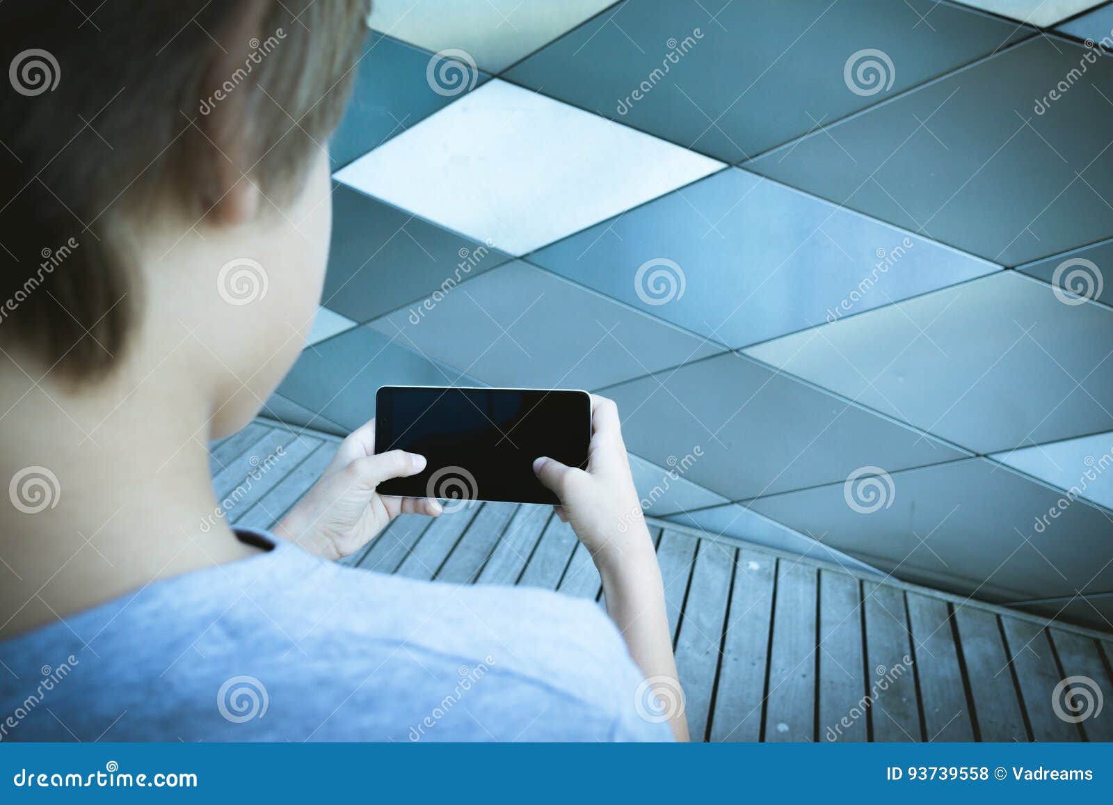 Boy Using Mobile Phone. Back View Stock Photo - Image of child, mobile ...