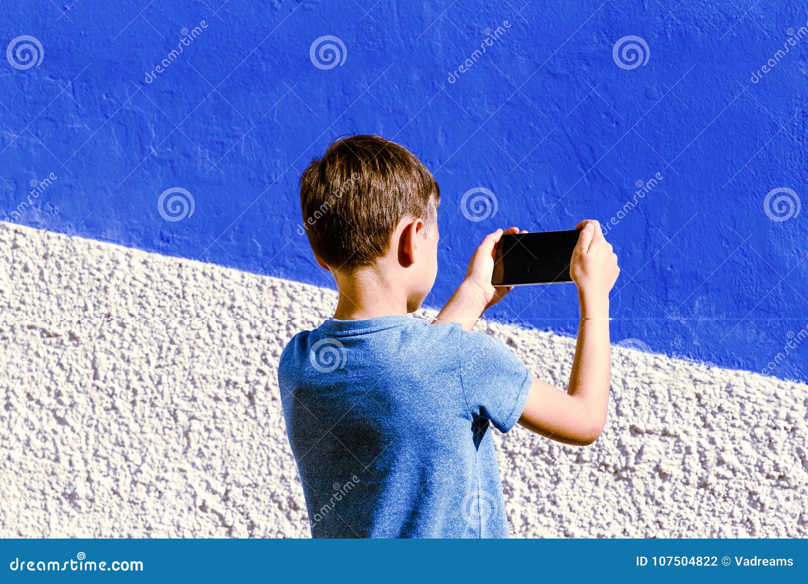 Boy Using Mobile Phone. Child Taking Photo with His Smartphone Stock ...