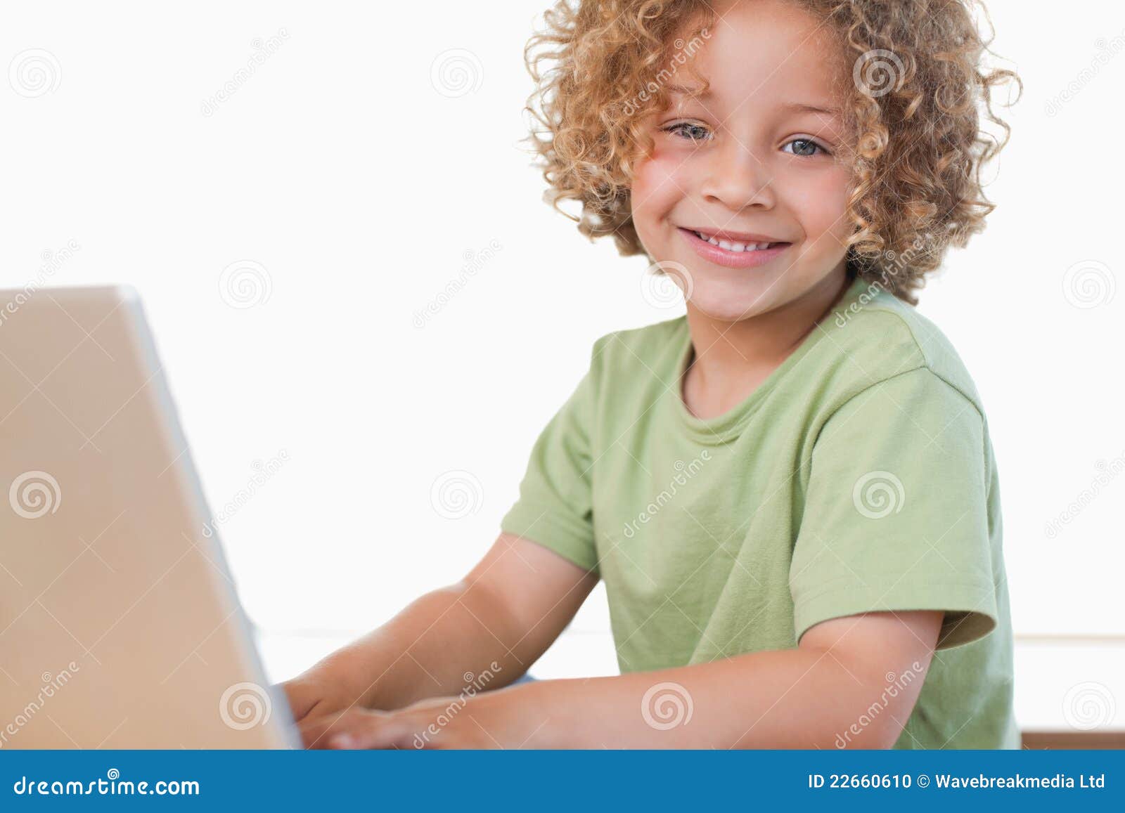 Boy using a notebook stock photo. Image of education - 22660610