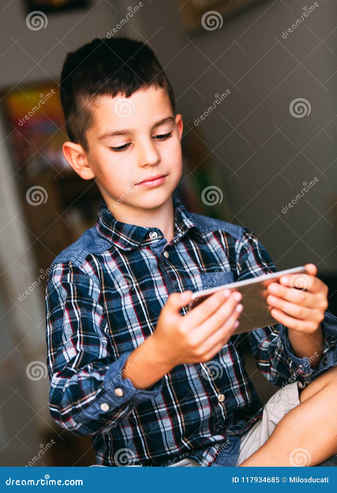 Boy using phone stock image. Image of person, childhood - 117934685