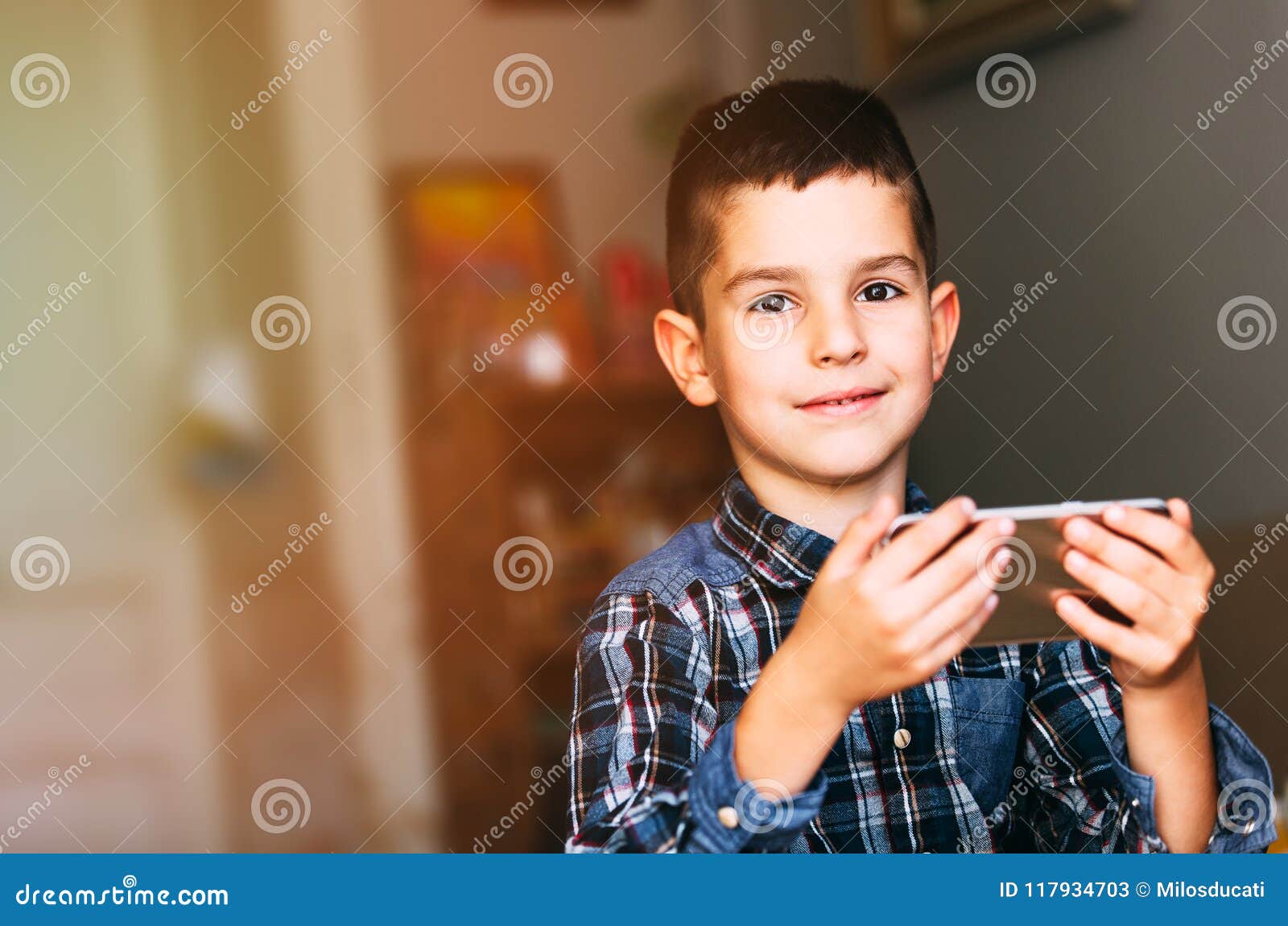 Boy using phone stock image. Image of happy, indian - 117934703
