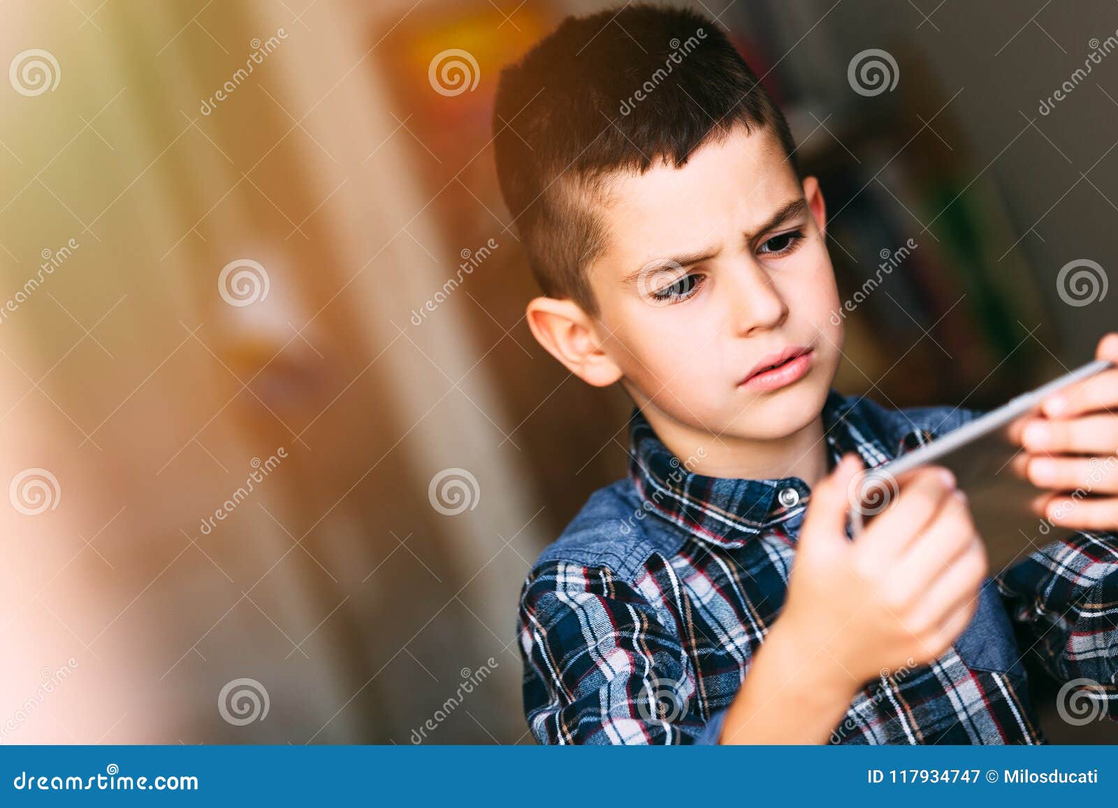 Boy using phone stock image. Image of people, device - 117934747
