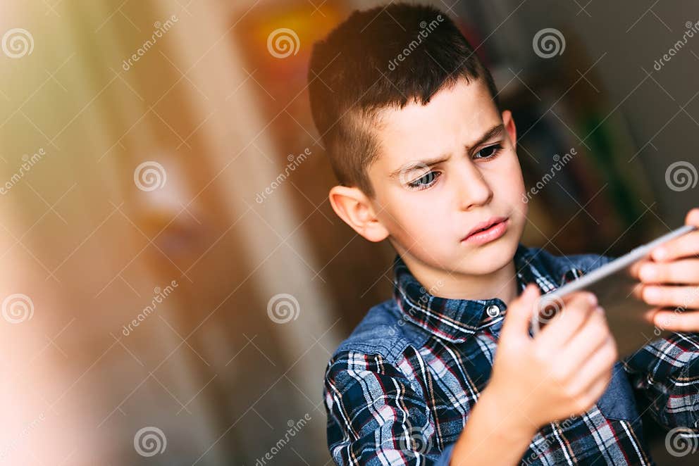 Boy using phone stock image. Image of people, device - 117934747