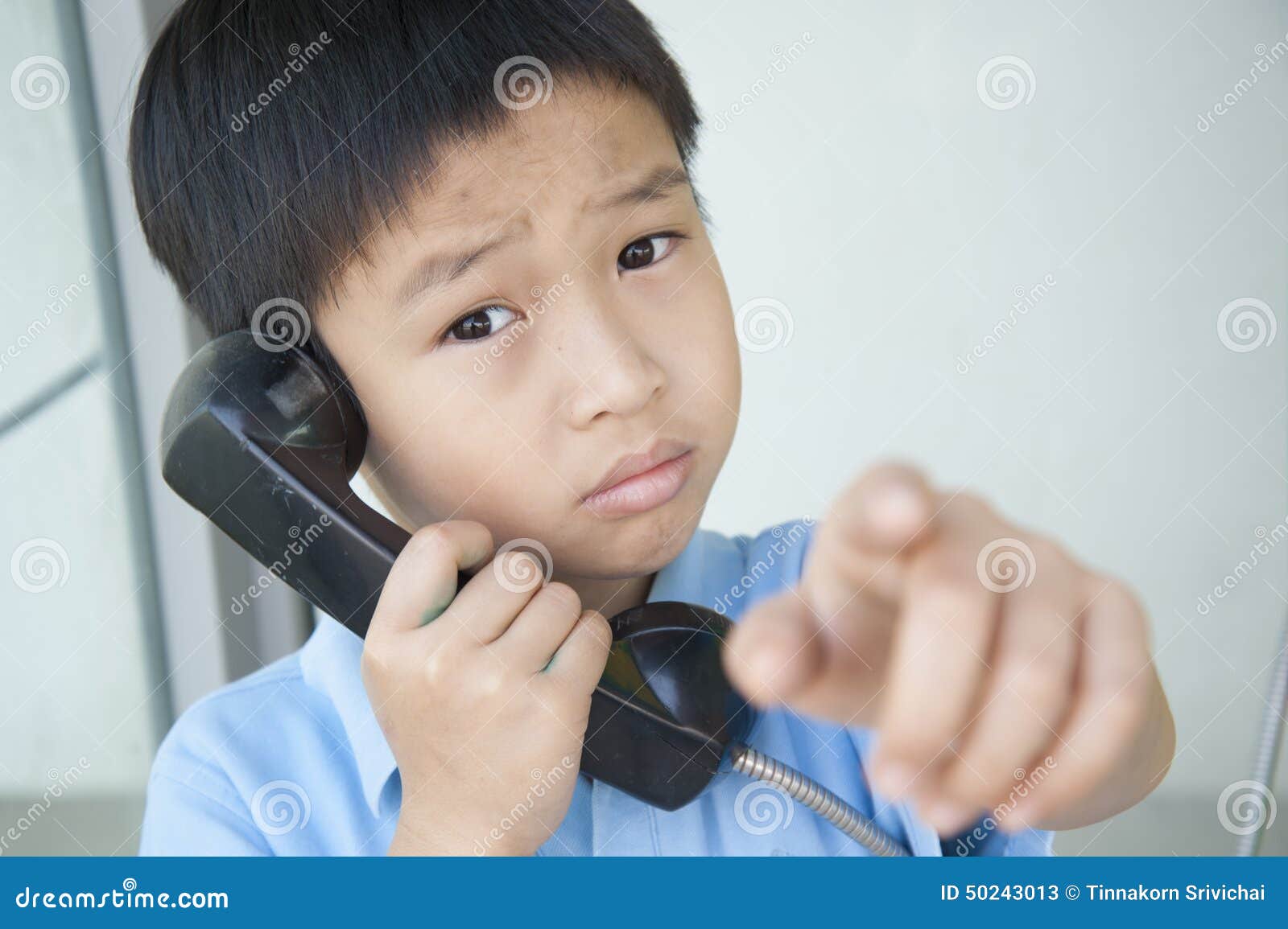 Boy using public phone stock image. Image of young, cute - 50243013