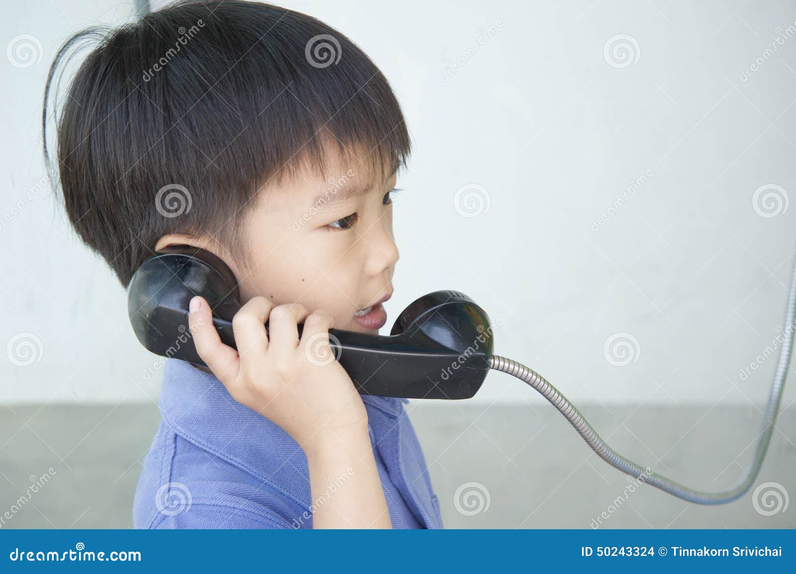 Boy using public phone stock photo. Image of booth, cute - 50243324