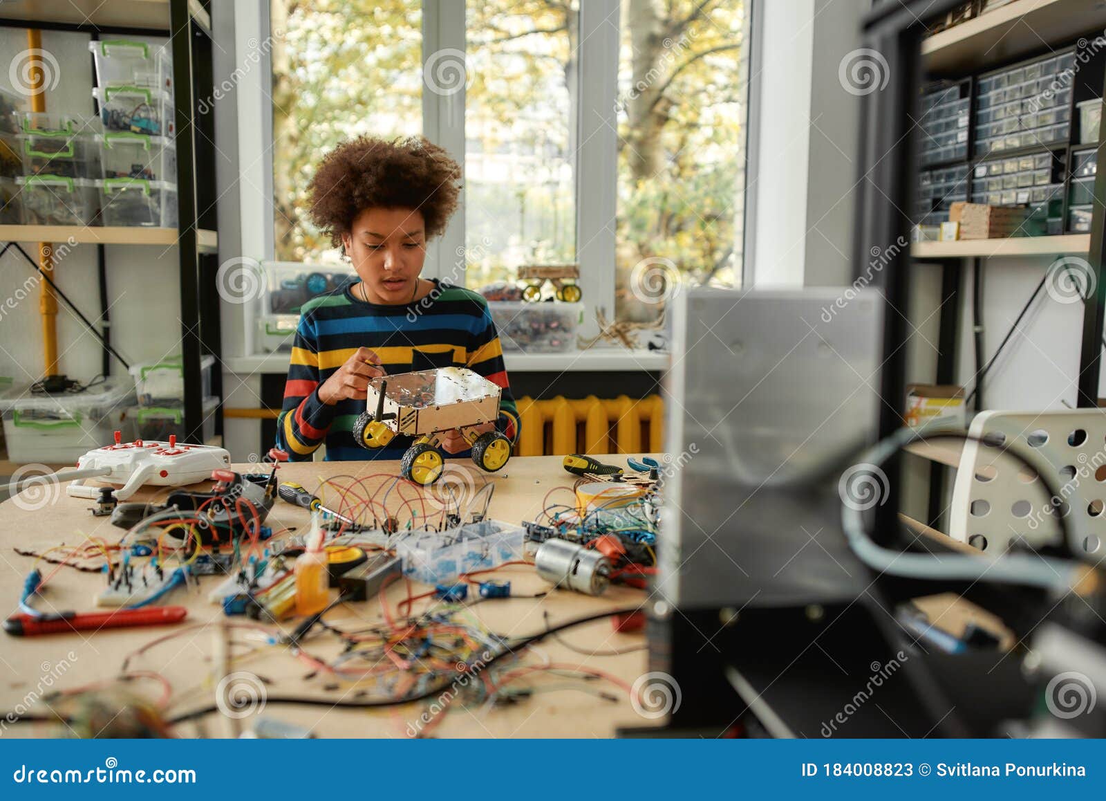 Quality in Every Work. Boy Using Screwdriver while Fixing Bolts on a ...