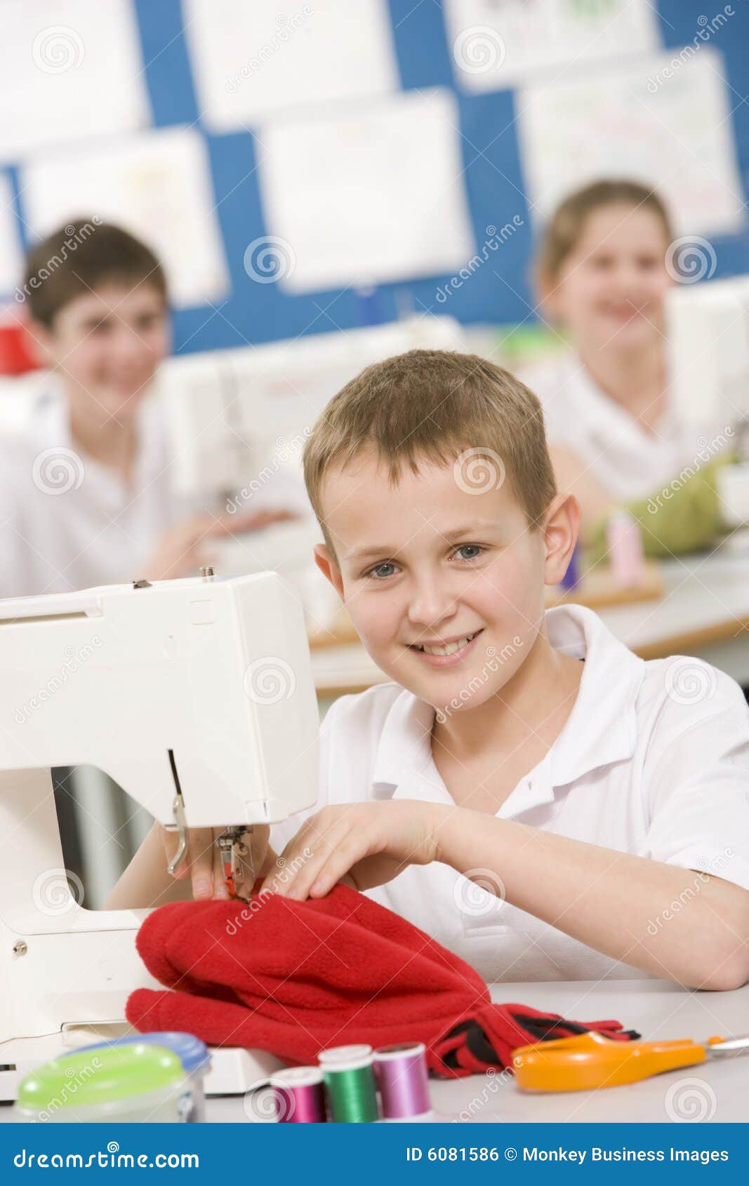 Boy using a sewing machine stock photo. Image of indoors - 6081586