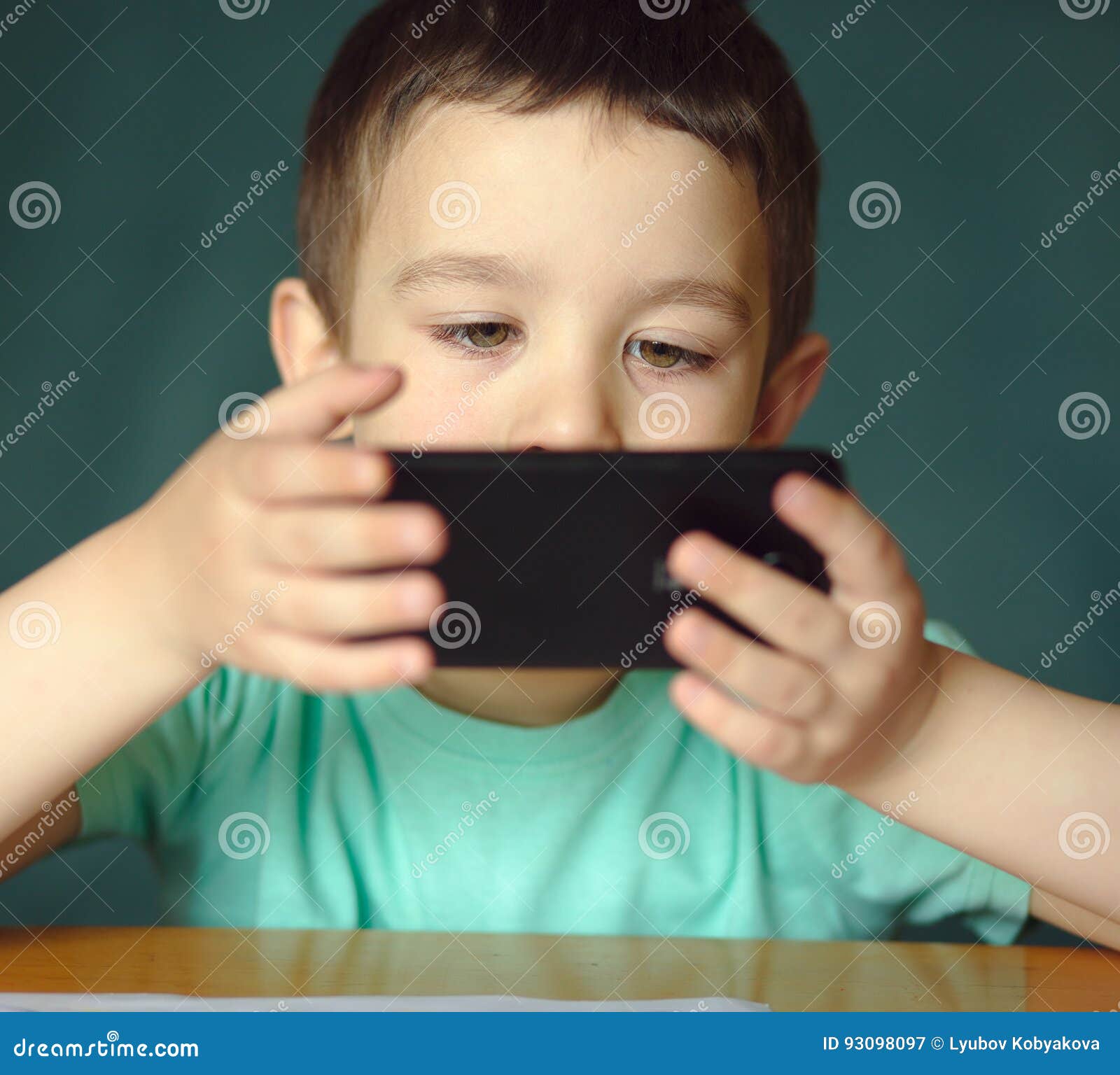Boy is using smartphone stock image. Image of closeup - 93098097