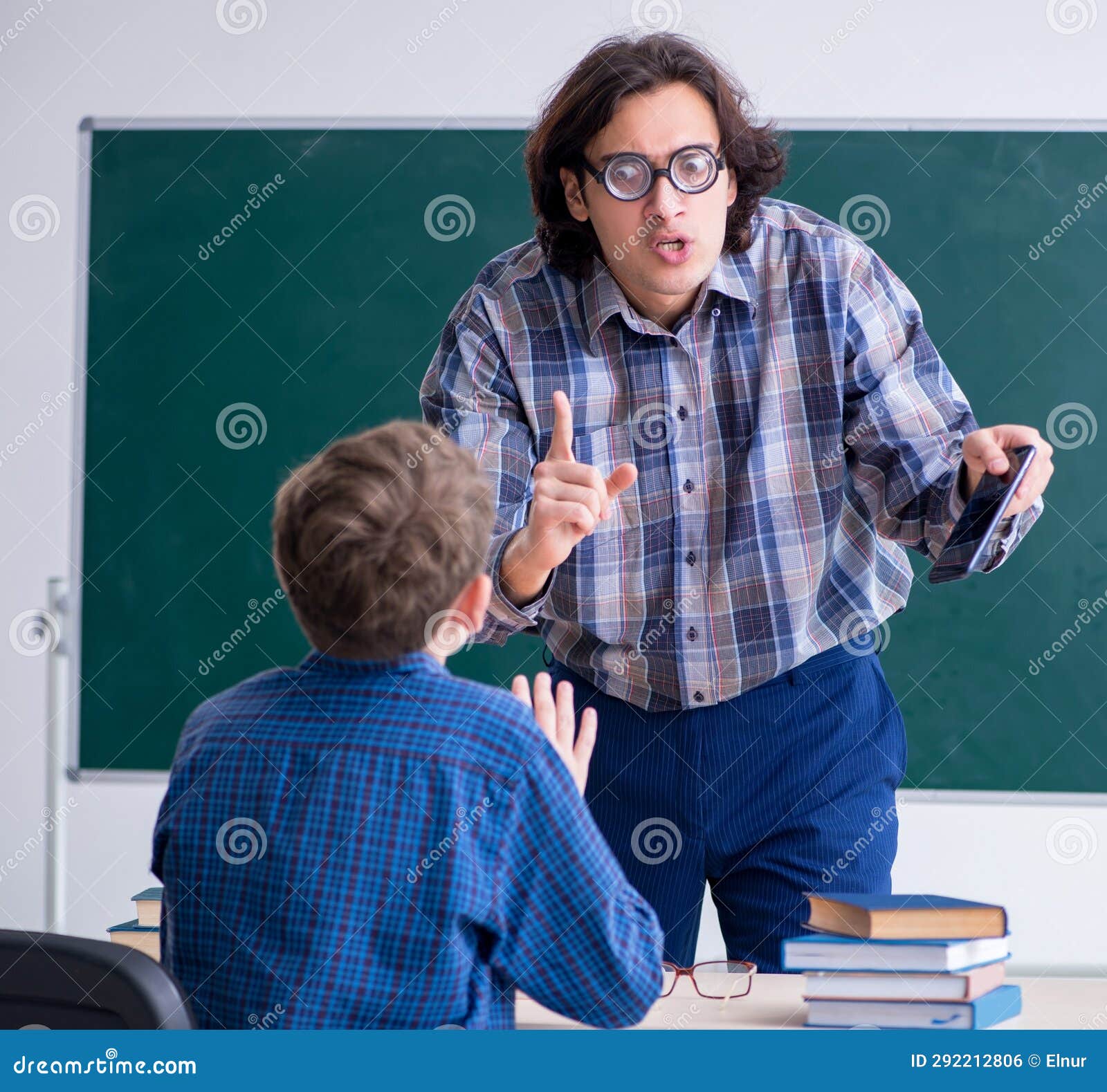 Boy Using Smartphone during the Lesson Stock Photo - Image of lecturer ...