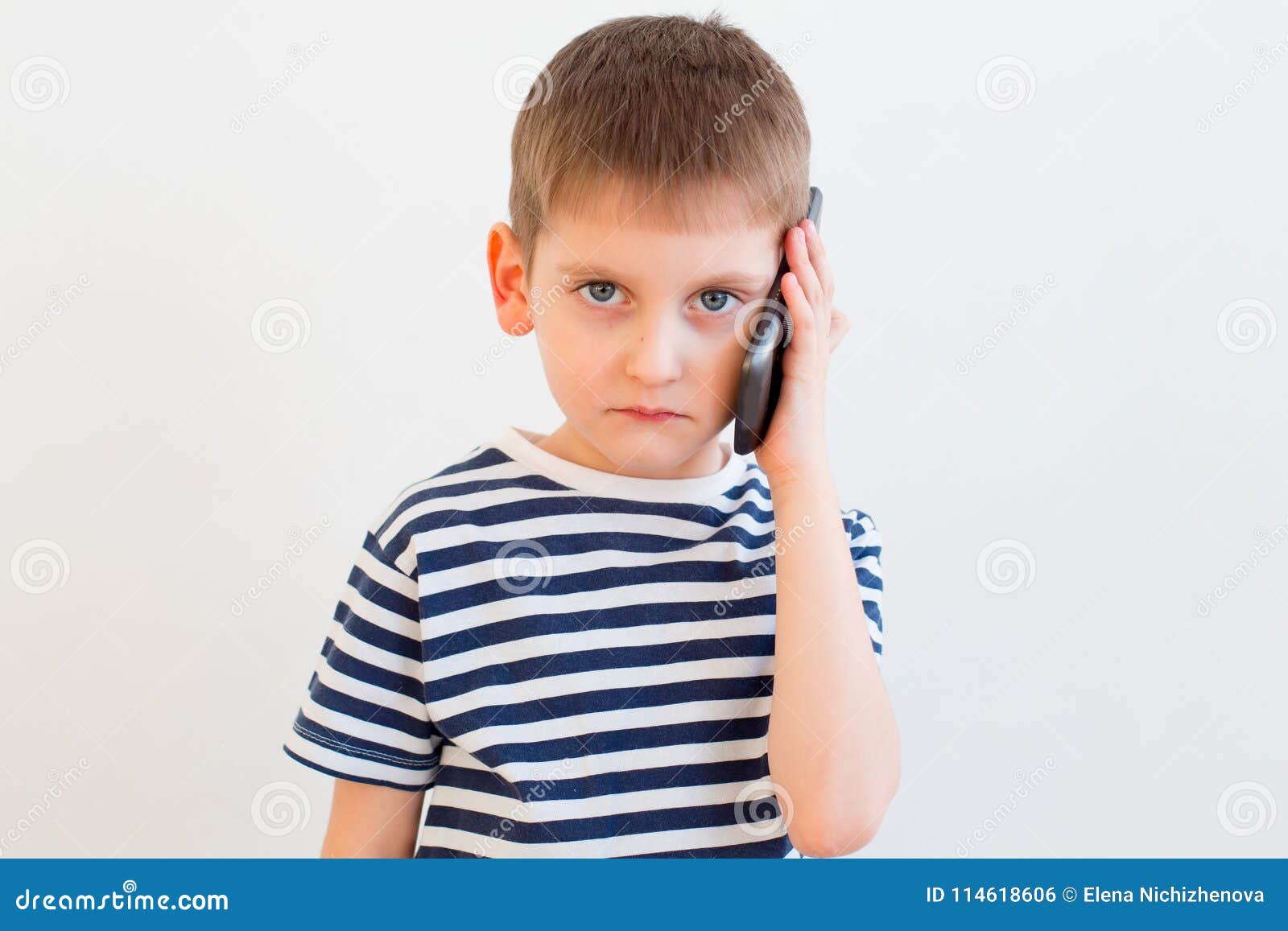 Boy using a smartphone stock photo. Image of phone, casual - 114618606