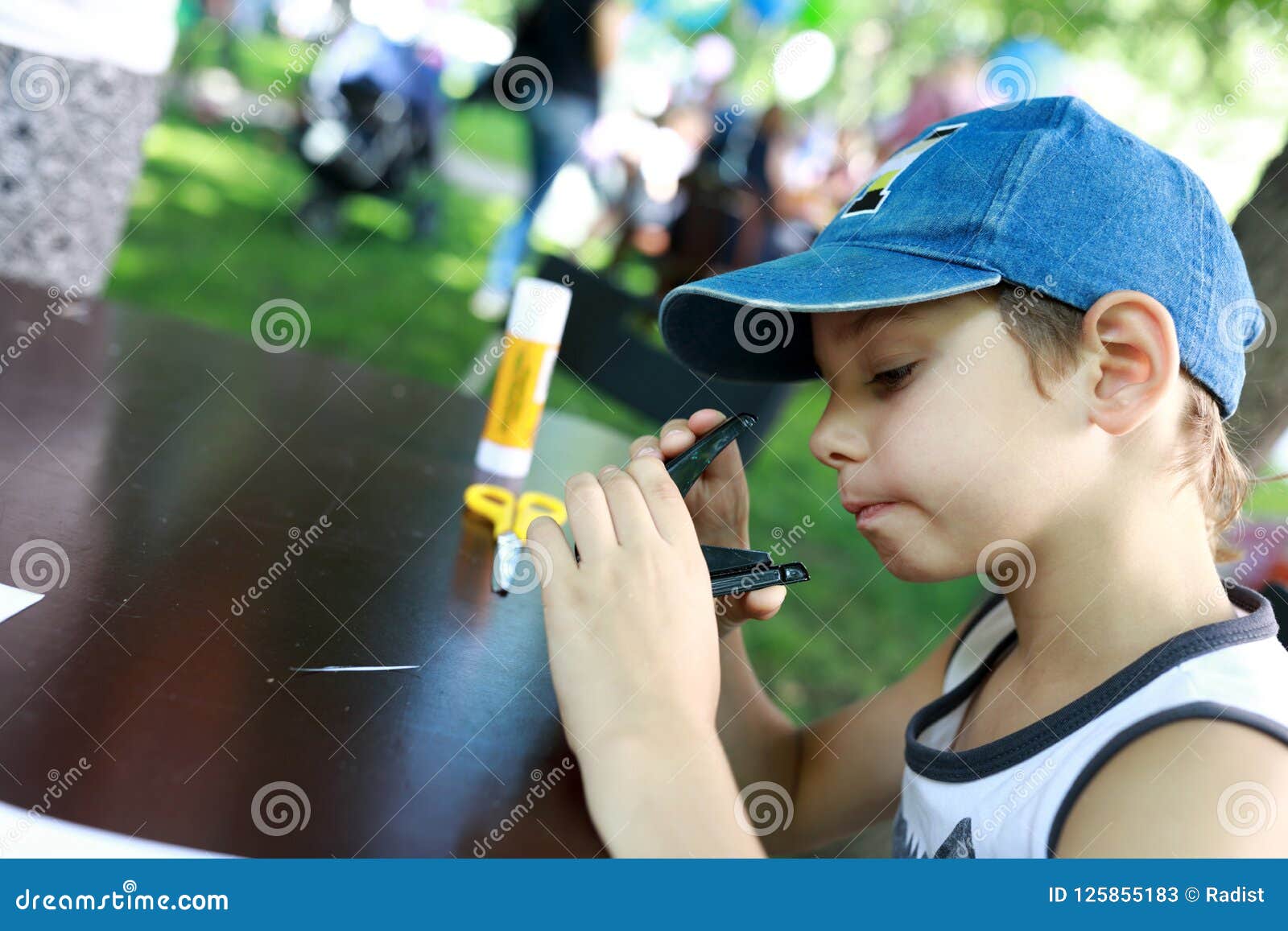 Boy using stapler stock image. Image of person, play - 125855183