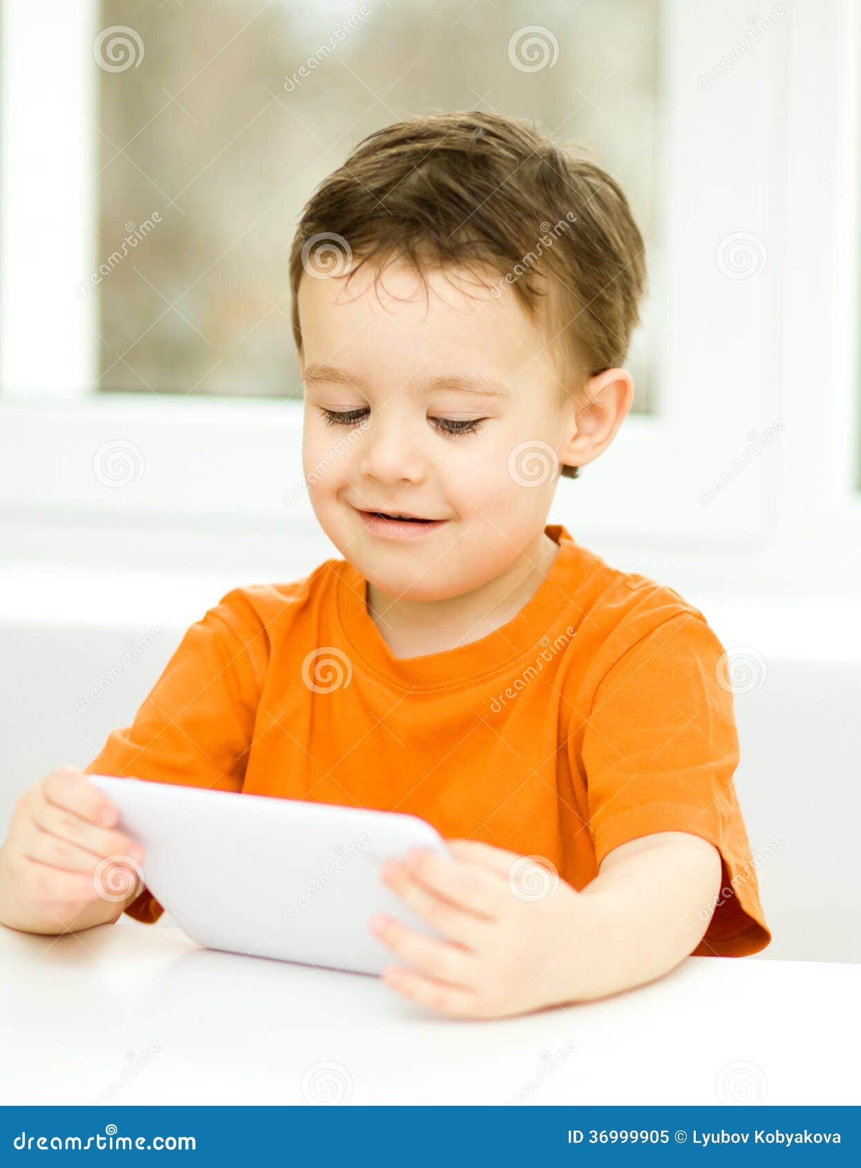 Boy using tablet stock image. Image of lying, digital - 36999905