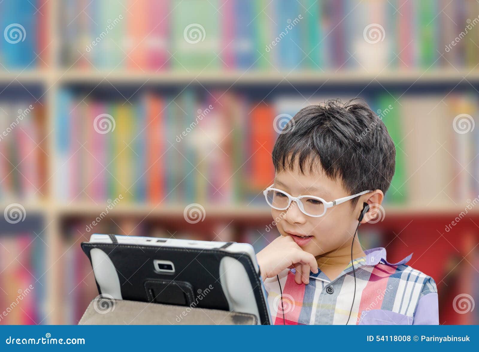 Boy Using Tablet Computer and Earphone Stock Photo - Image of computer ...