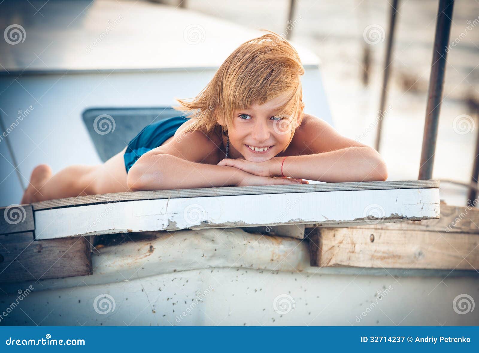Boy vacationer by the boat stock image. Image of outdoor - 32714237