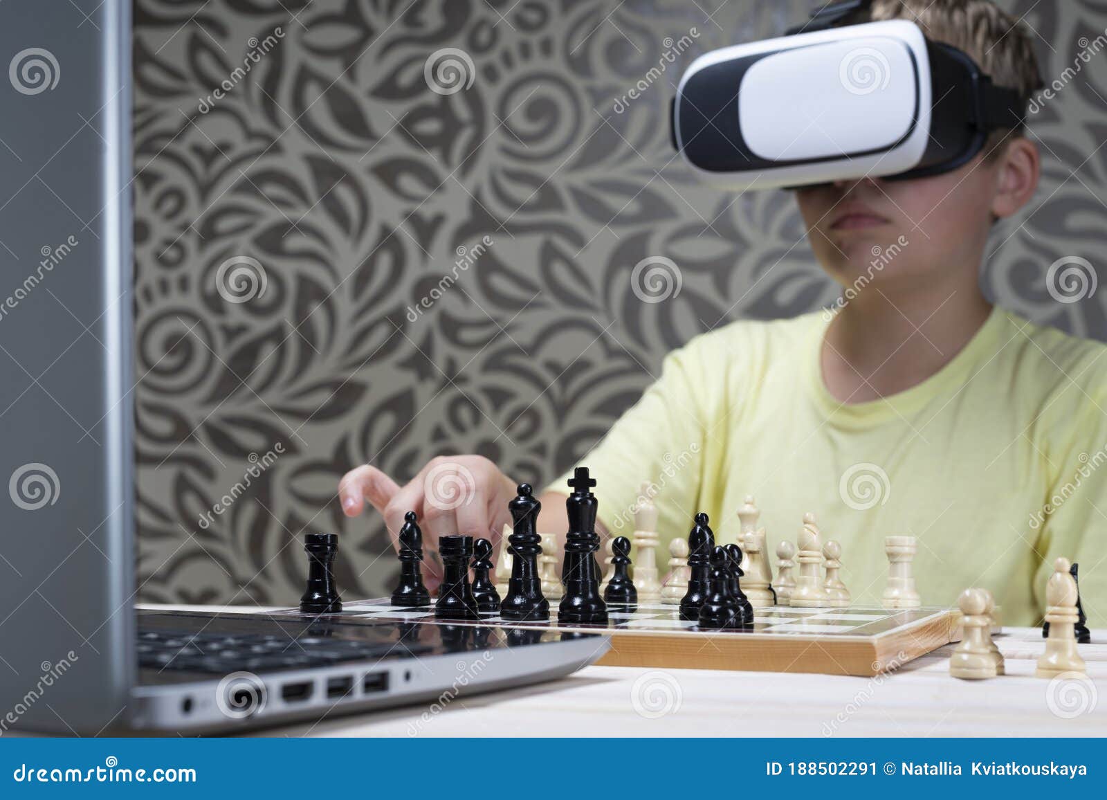 A Boy in a Virtual Reality Headset Plays Chess with a Laptop. Learning ...