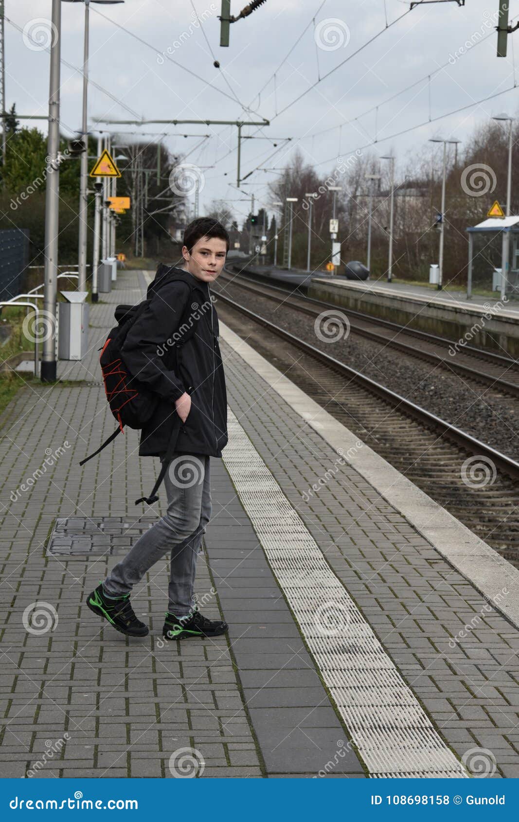 Boy waiting for the train stock photo. Image of lines - 108698158