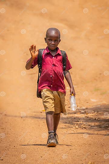 A Boy Walking Alone on a Path in a Rural Landscape in Uganda. Editorial ...