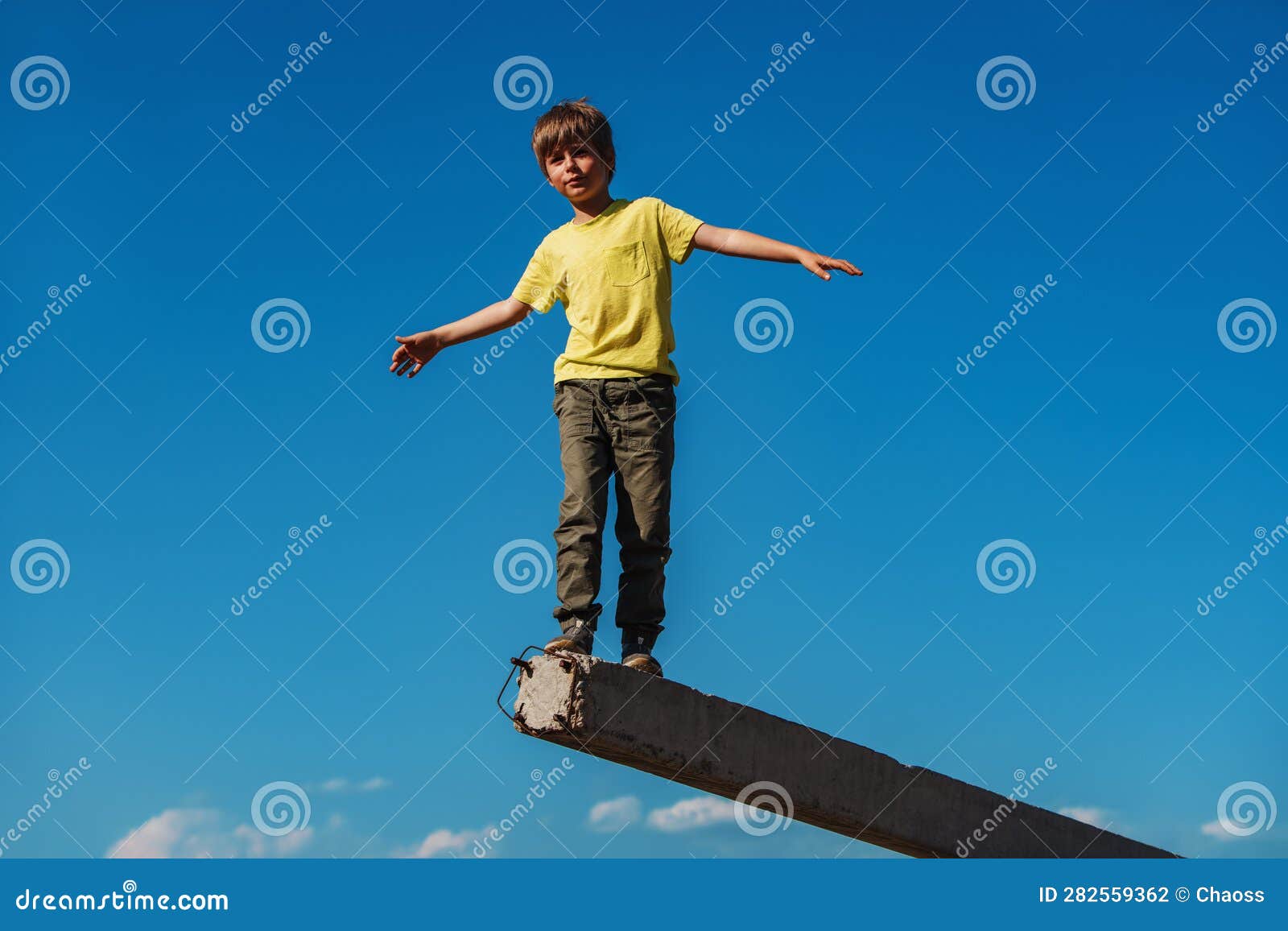 Boy Walking and Balancing on Blue Sky Backgrounds Stock Photo - Image ...
