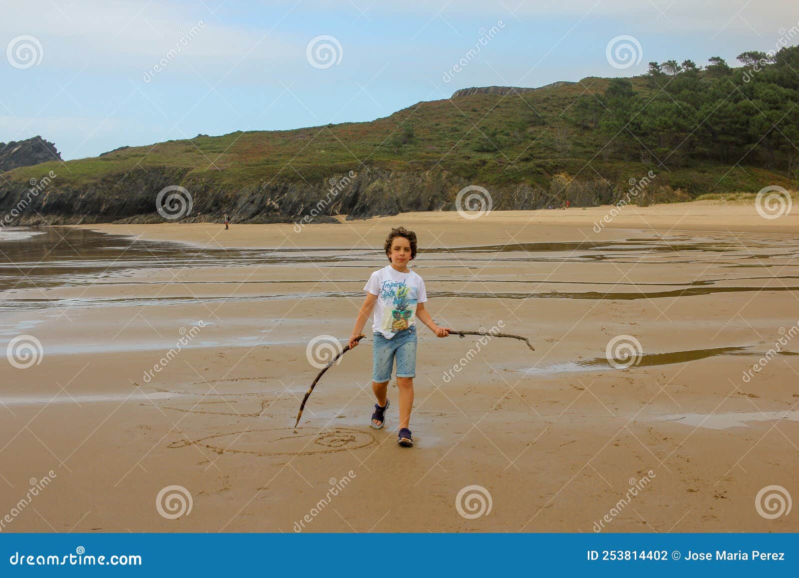 A boy walking in a beach stock photo. Image of playing - 253814402