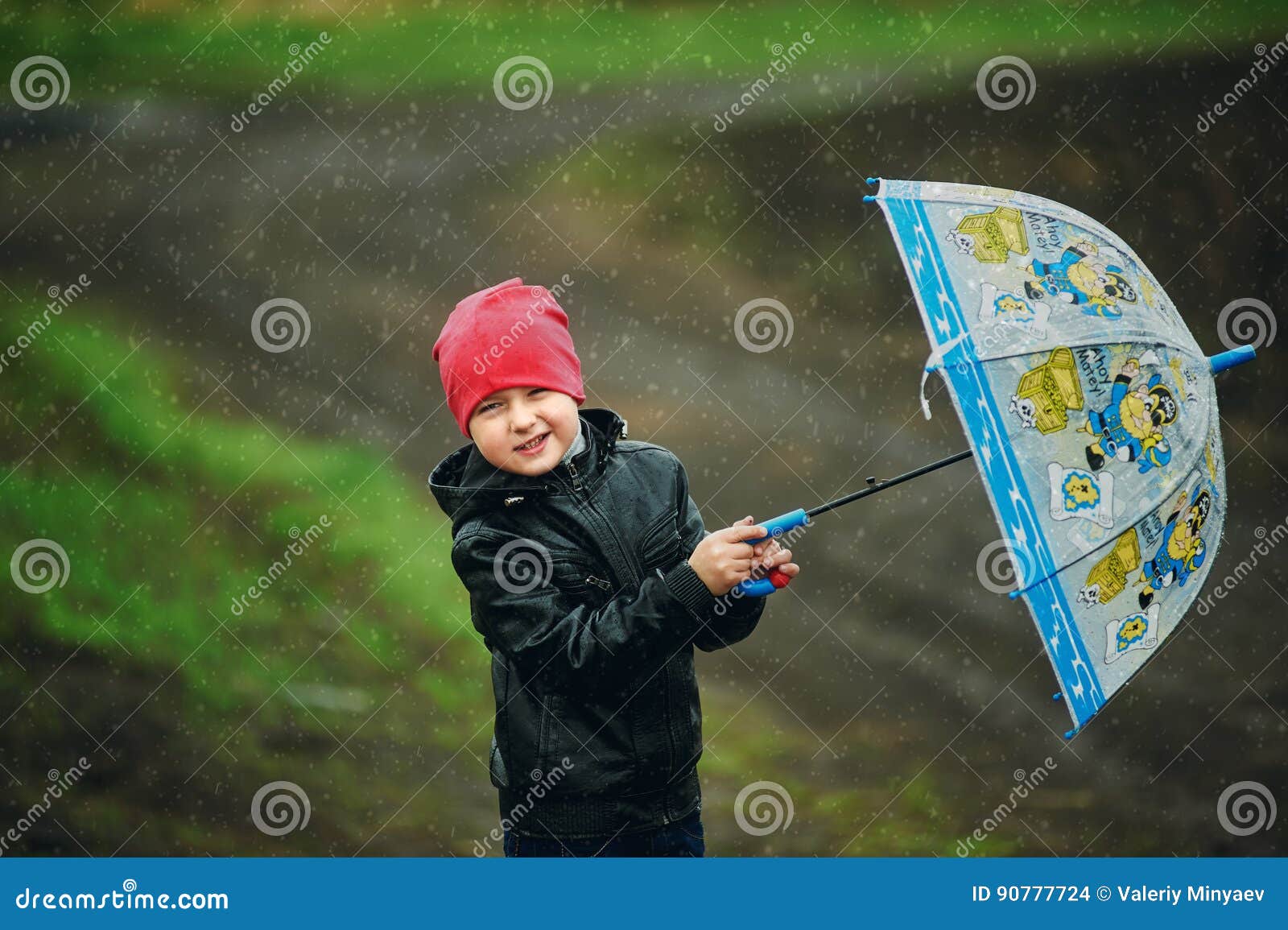Boy Walking in Field with Umbrella in the Rain Stock Photo - Image of ...