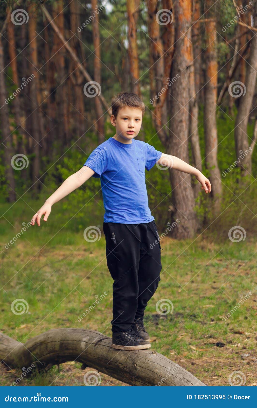 Boy Walks on a Log and Learns To Keep Balance Stock Image - Image of ...