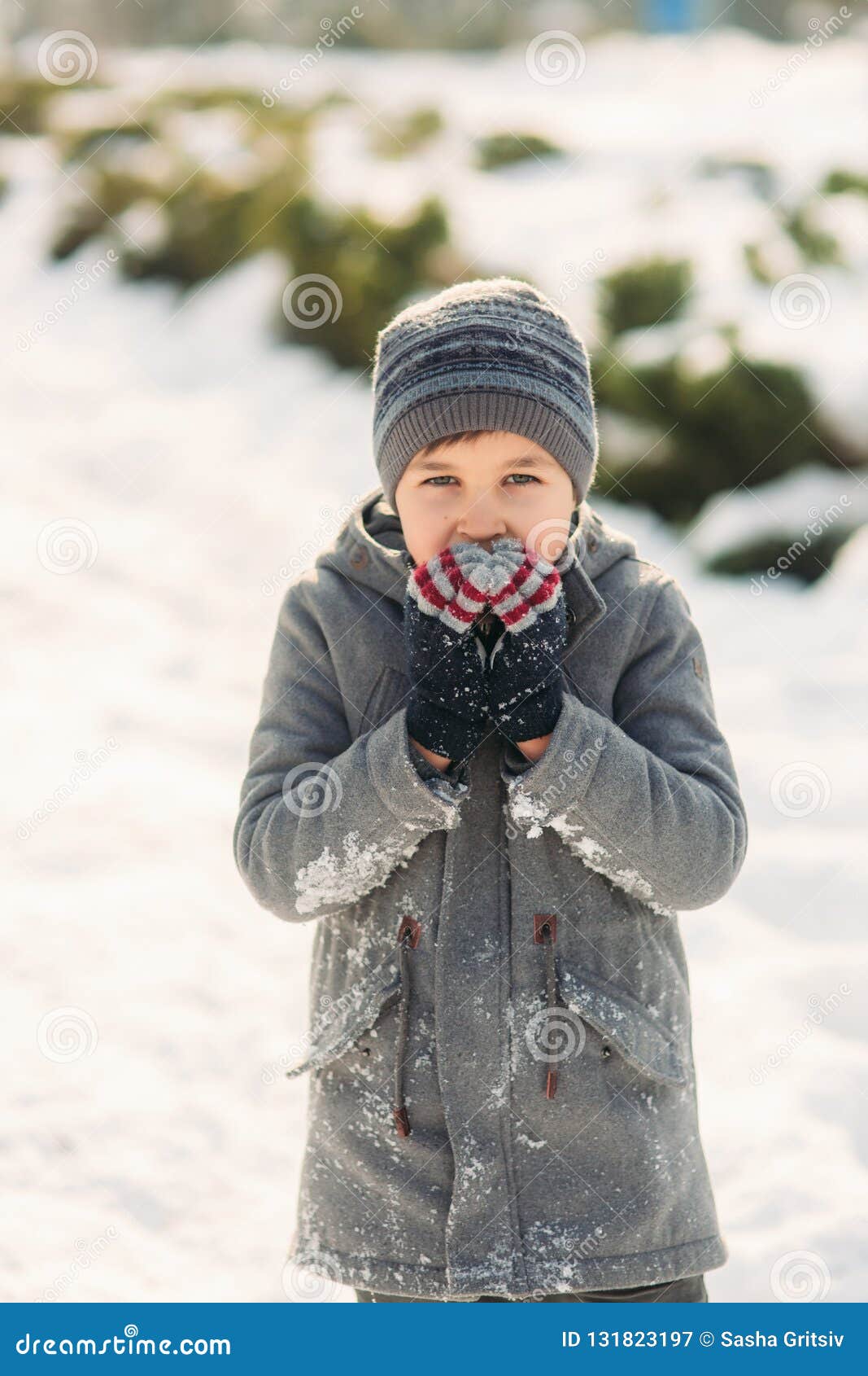 A Boy Warms His Hands from the Cold in Winter Stock Image - Image of ...