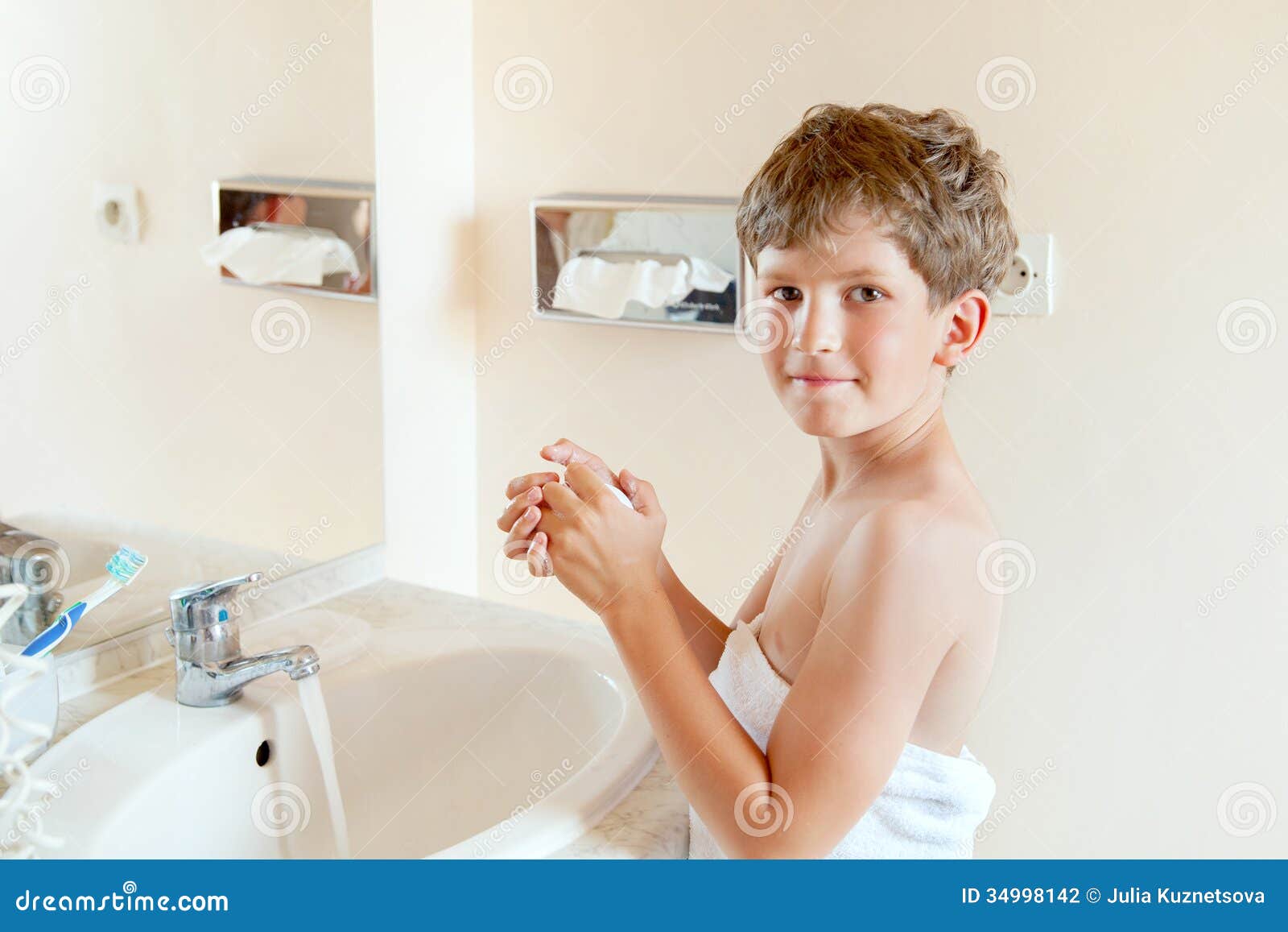 Boy washes hands stock photo. Image of attractive, sink - 34998142