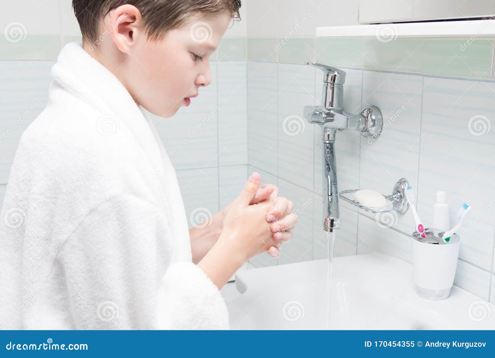 Boy Washes Hands with White Soap in a Sink with Water Stock Image ...