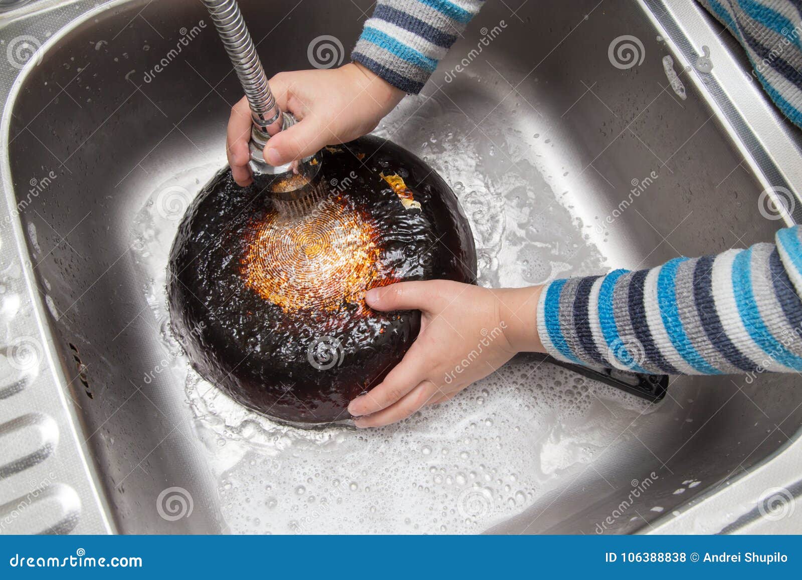 Boy Washing Dishes in the Kitchen Stock Photo - Image of splash, male ...