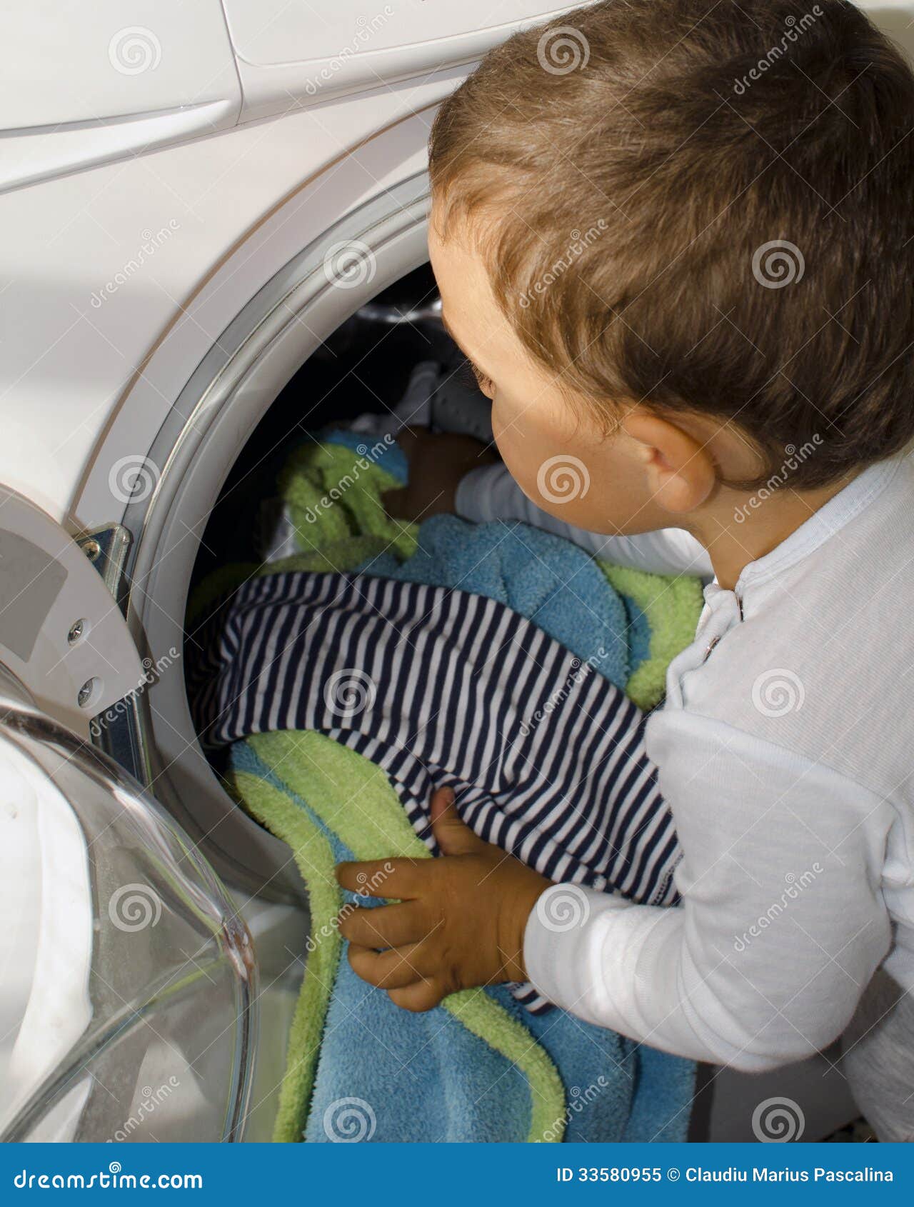 Boy at the washing machine stock image. Image of beautiful - 33580955