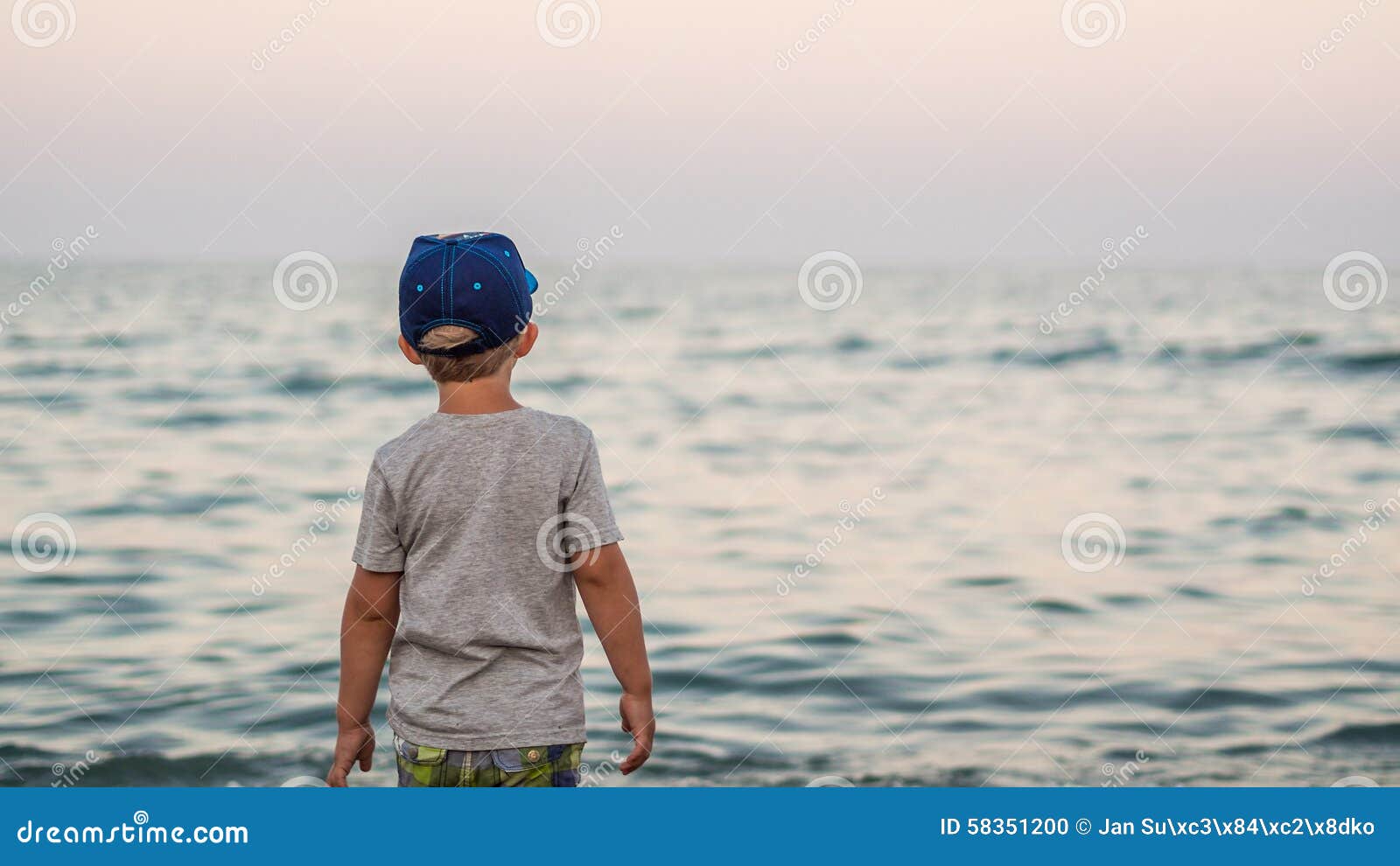 Boy is Watching Evening Sea Stock Photo - Image of recreation, nature ...
