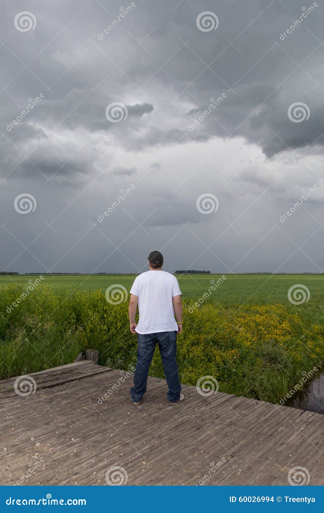 Boy Watching the Storm Clouds Stock Photo - Image of farm, outside ...