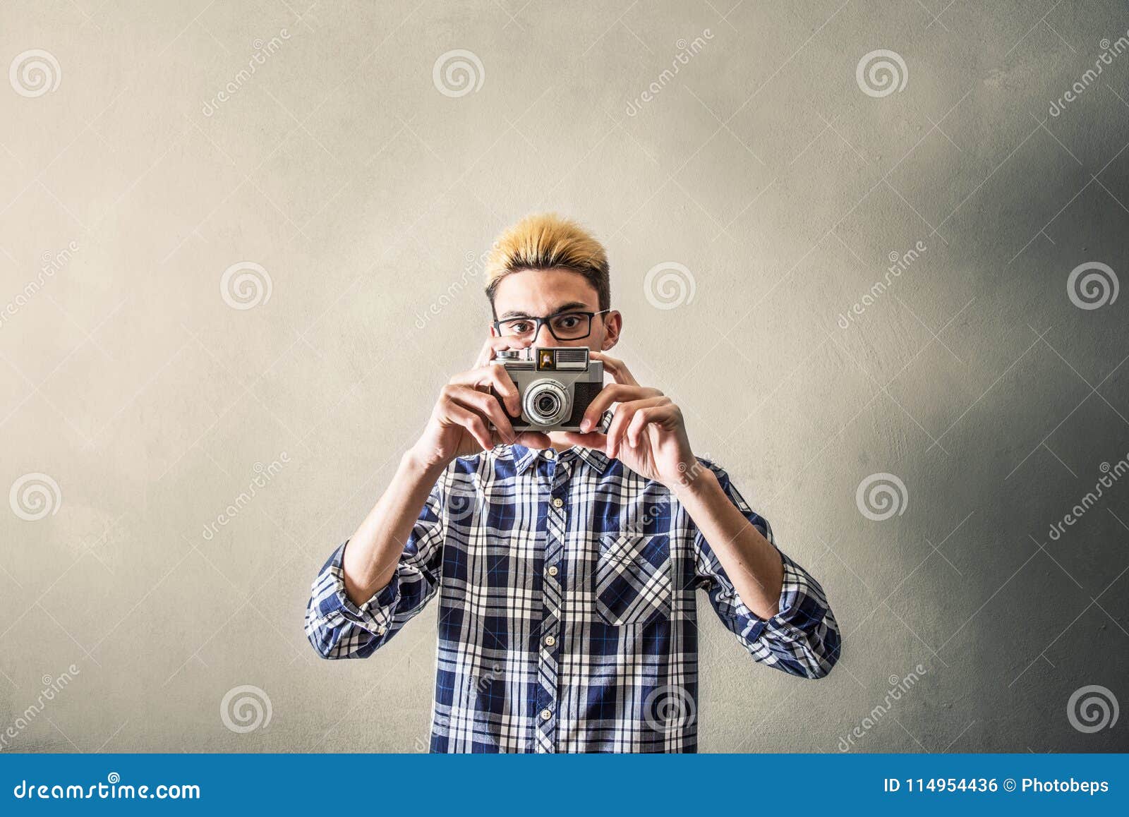 Boy Watching a Vintage Camera Stock Photo - Image of adult, camera ...