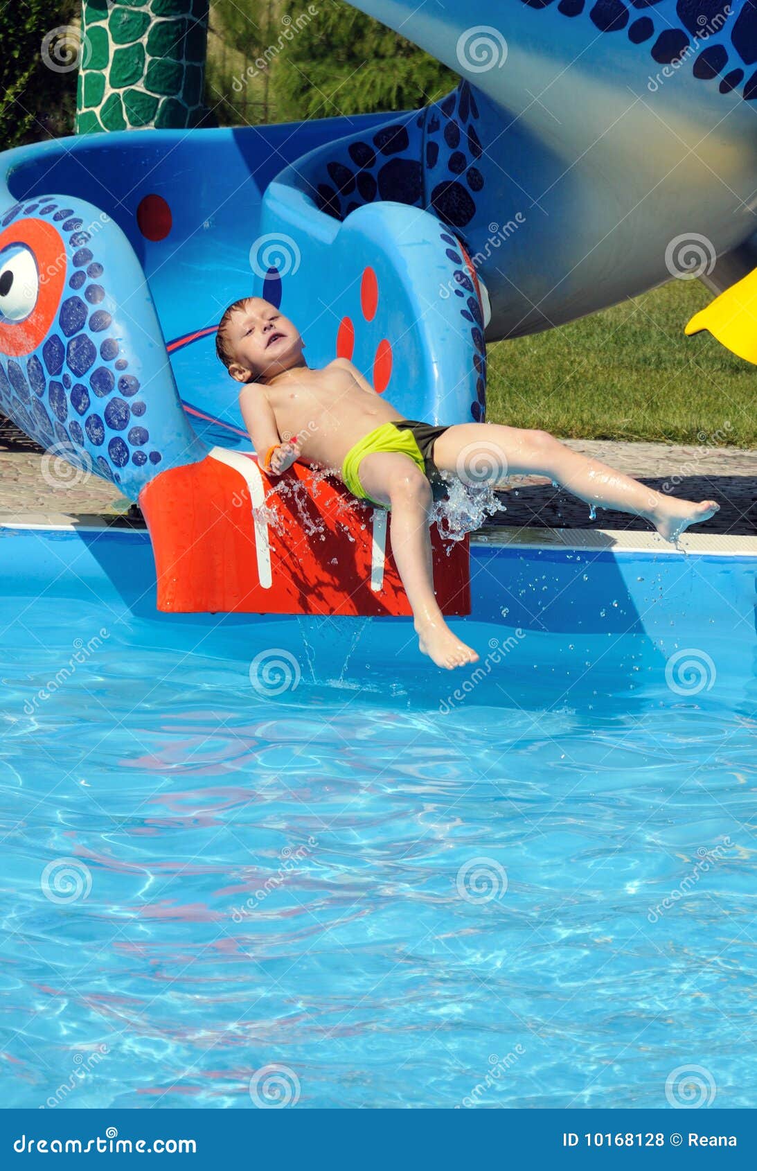 Boy on Water Slide stock photo. Image of childhood, slide - 10168128