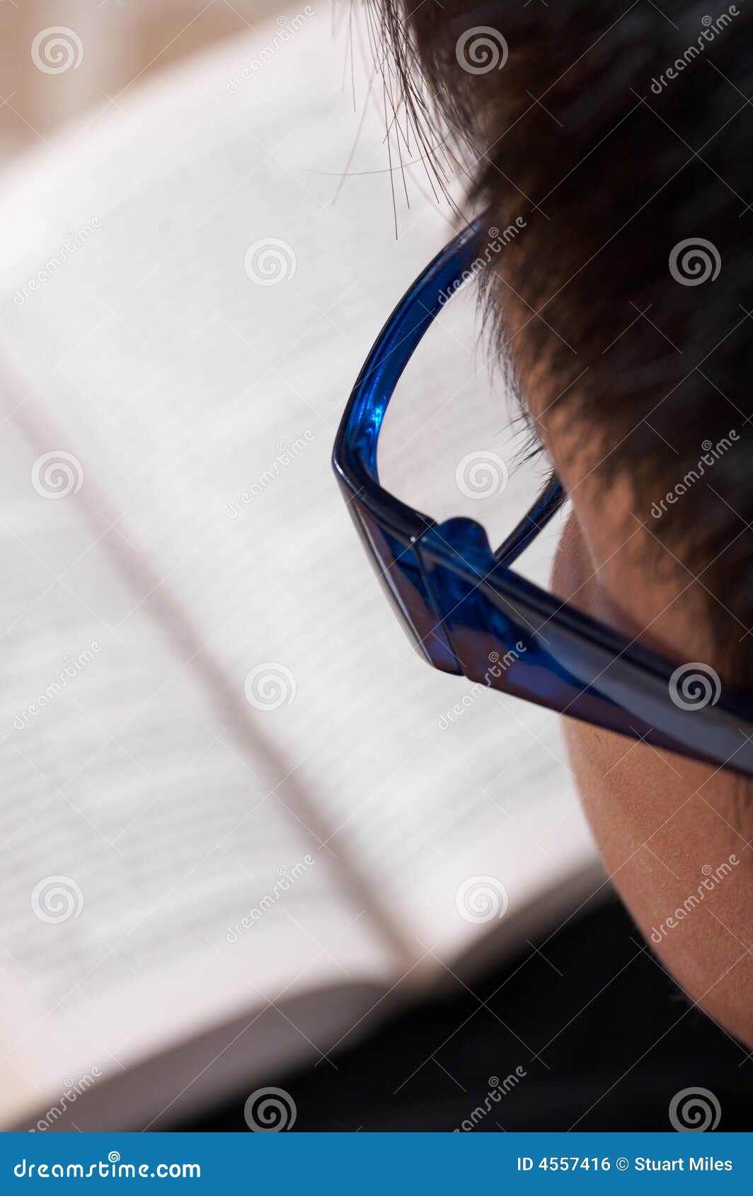 Boy Wearing a Blue Eyeglasses Stock Photo - Image of blue, read: 4557416