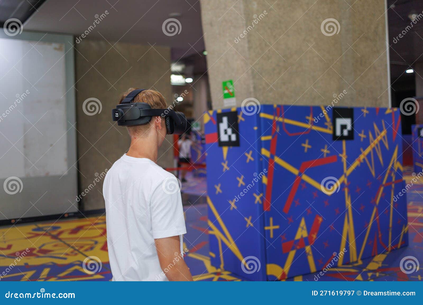 Boy Wearing a Virtual Reality Visor Inside a Play Space Set Up for the ...