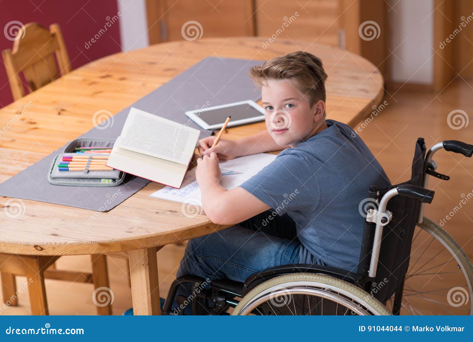 Boy in Wheelchair Doing Homework Stock Photo - Image of room, children ...