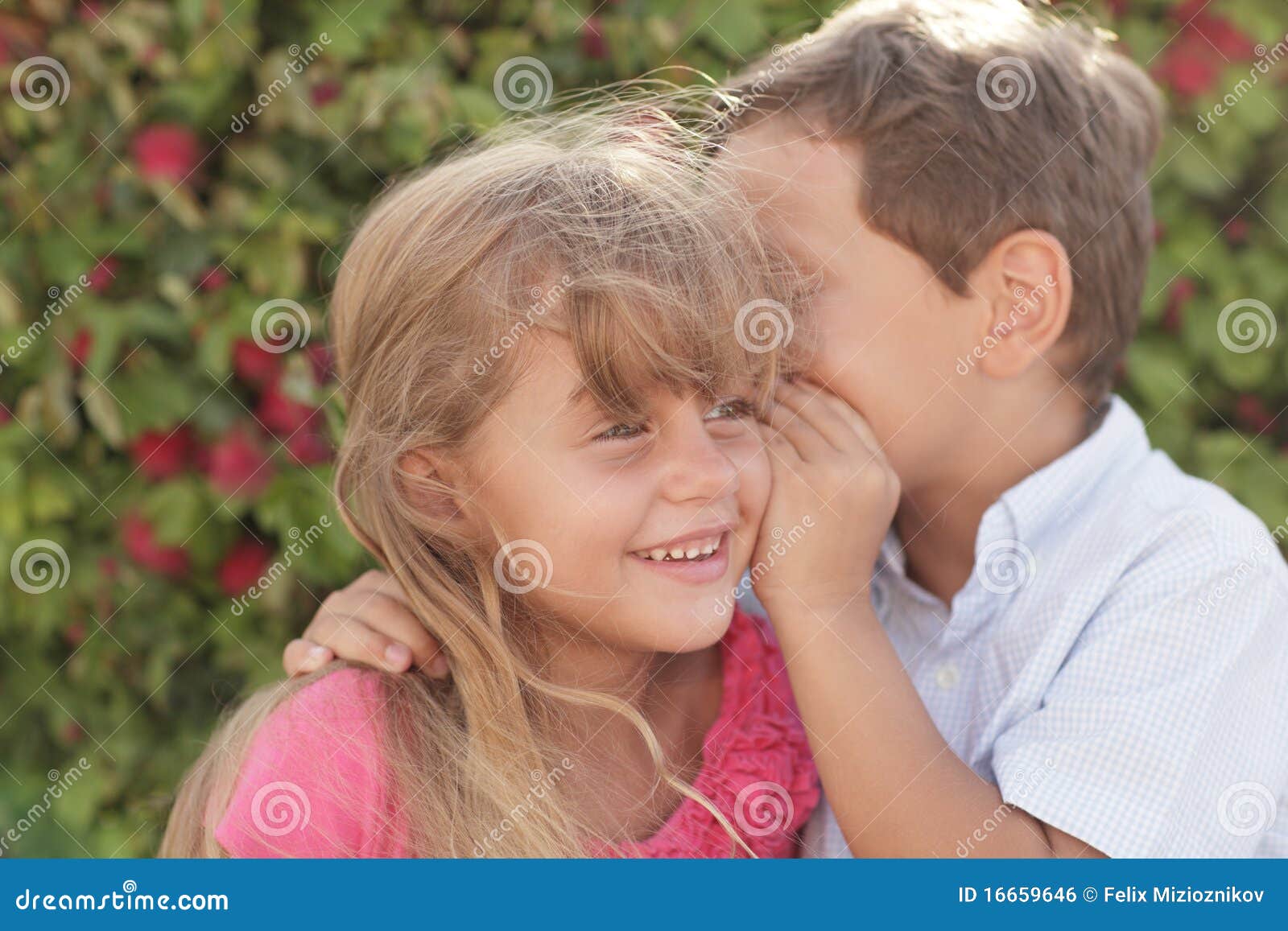 Boy whispering a secret stock photo. Image of close, telling - 16659646
