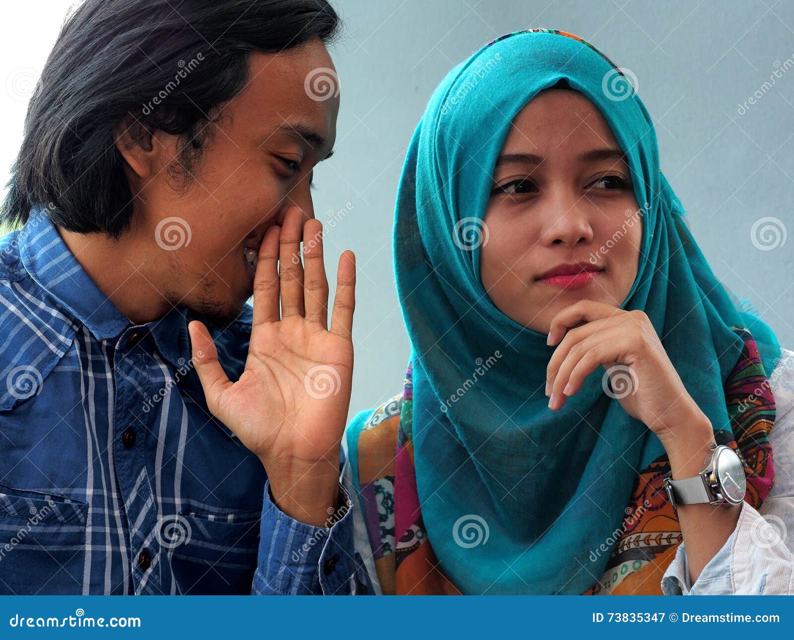 A boy whispering to a girl stock image. Image of whispering - 73835347