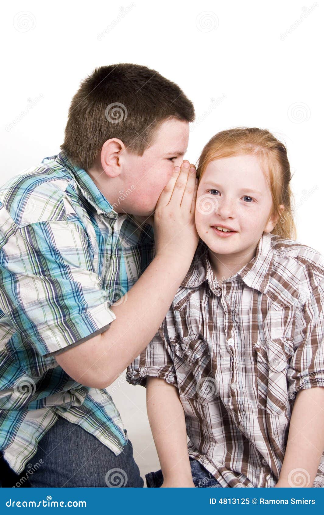 Boy Whispers In Girls Ear Picture. Image: 4813125