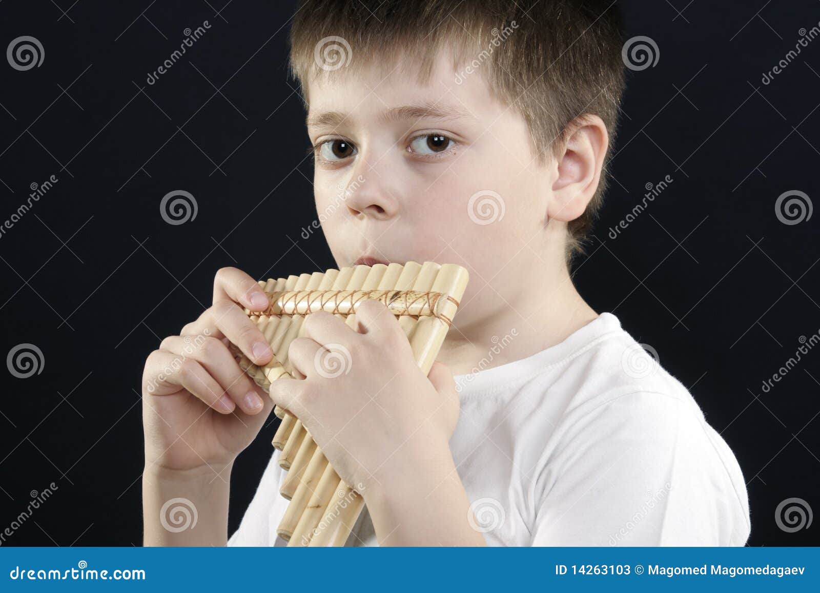 Man Playing Bamboo Instrument With Lagoon Background Royalty-Free Stock ...