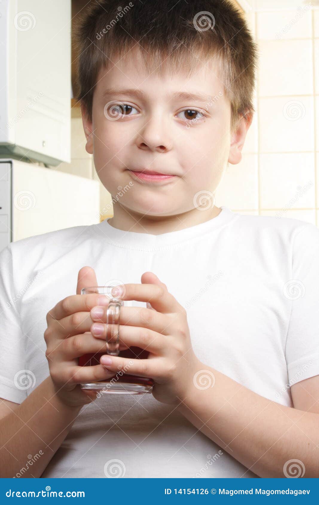 Boy in white with tea stock photo. Image of portrait - 14154126