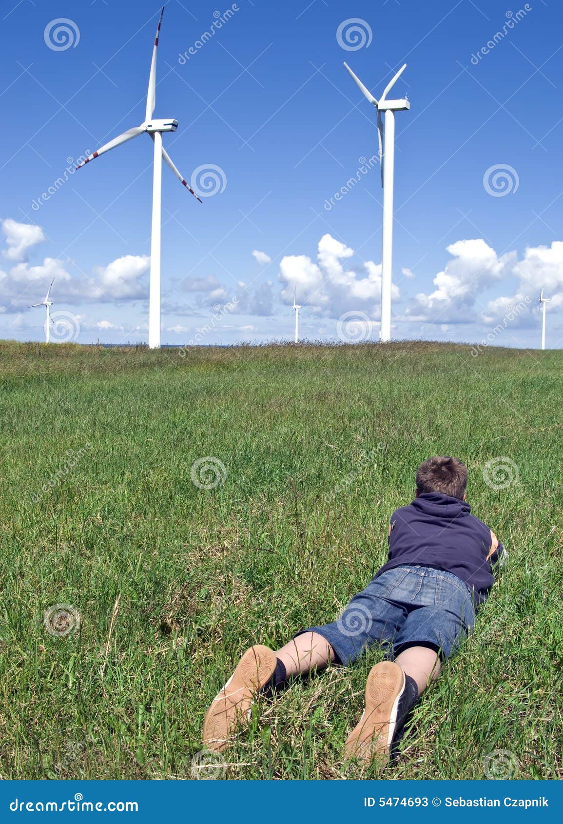 Boy and wind turbines stock image. Image of distanced - 5474693