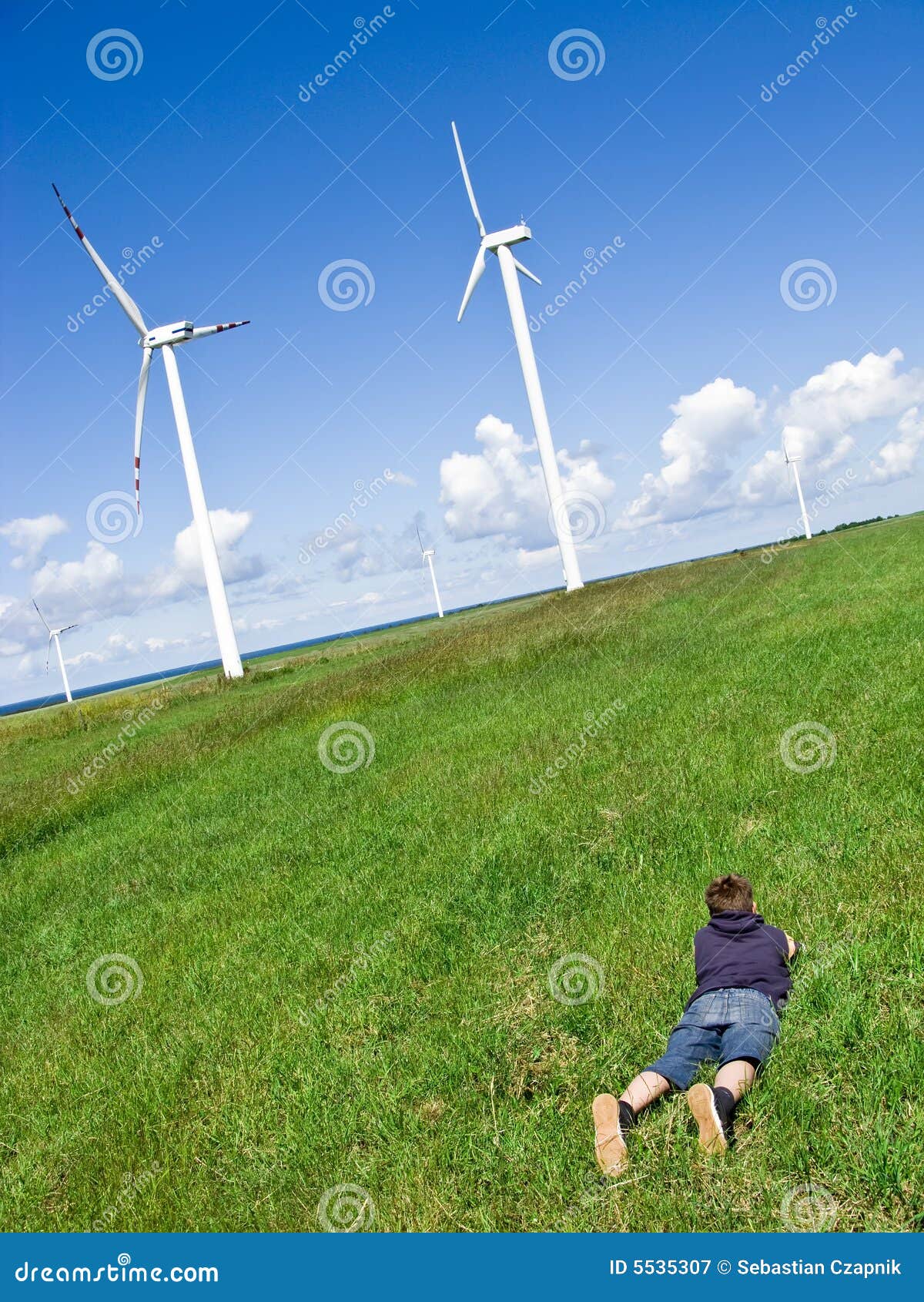 Boy and wind turbines stock image. Image of looks, green - 5535307