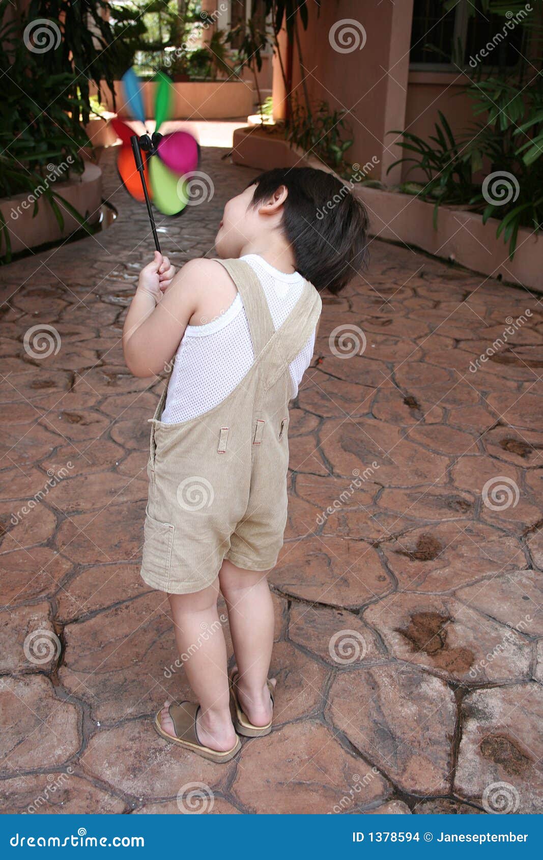 Boy & windmill stock photo. Image of asian, leisure - 1378594