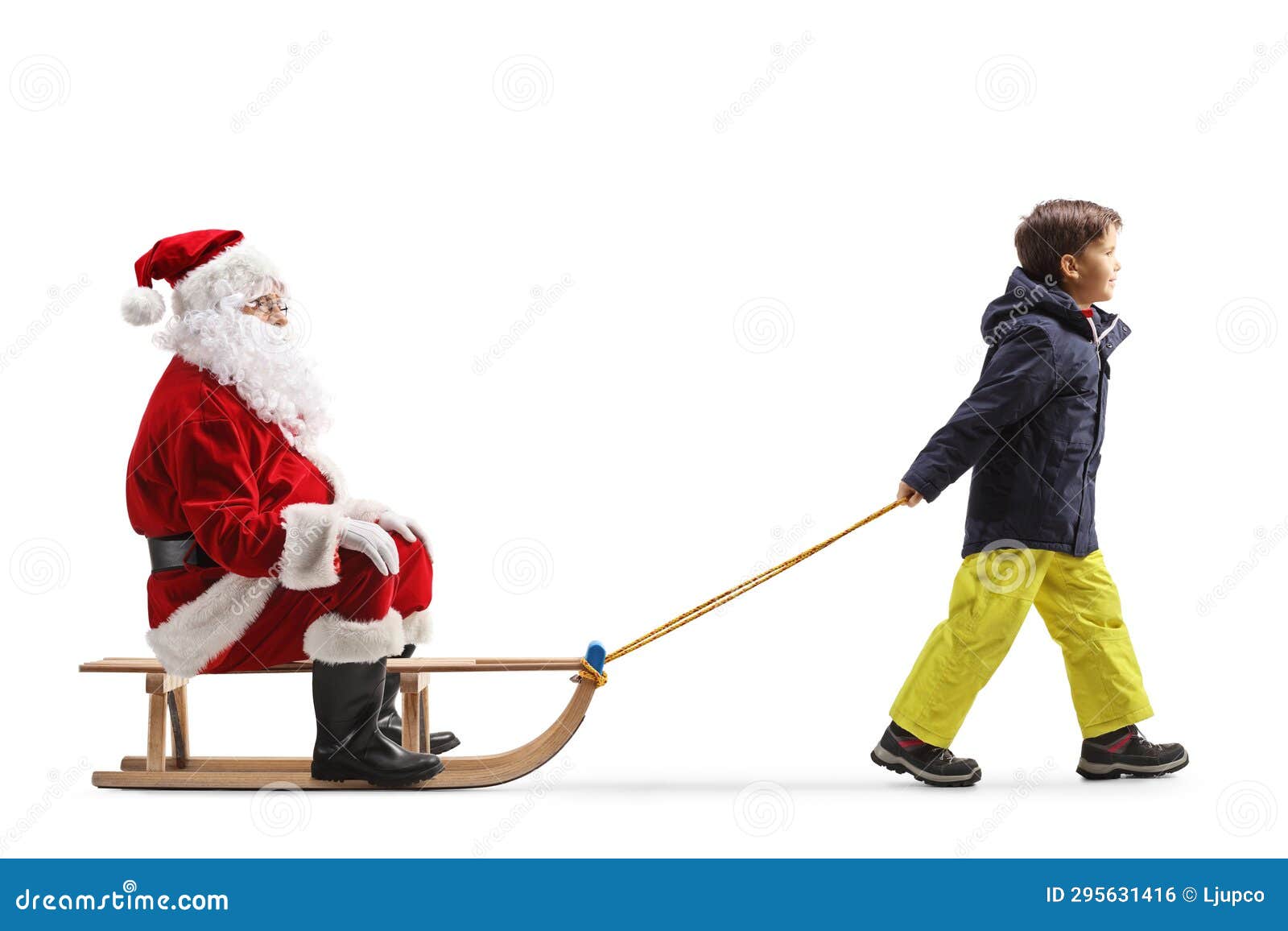 Boy in Winter Clothes Pulling Santa on a Sled Stock Photo - Image of ...